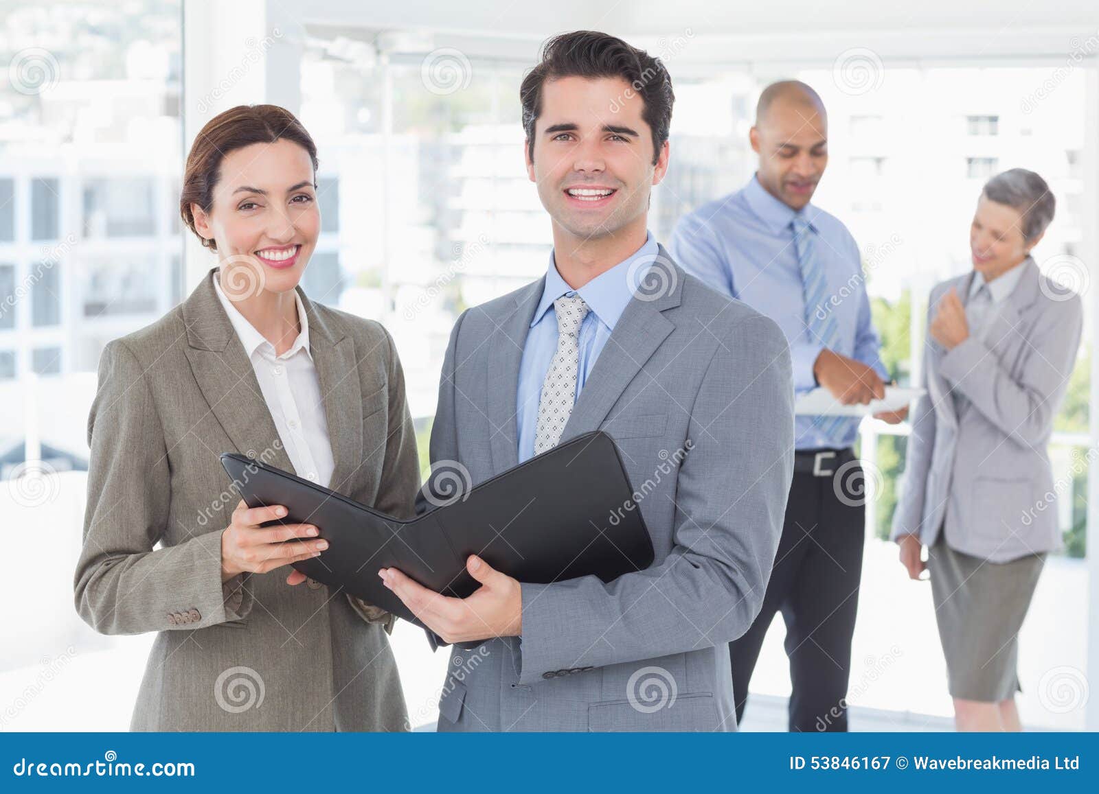 Colleagues Speaking about Work Stock Image - Image of indoors ...