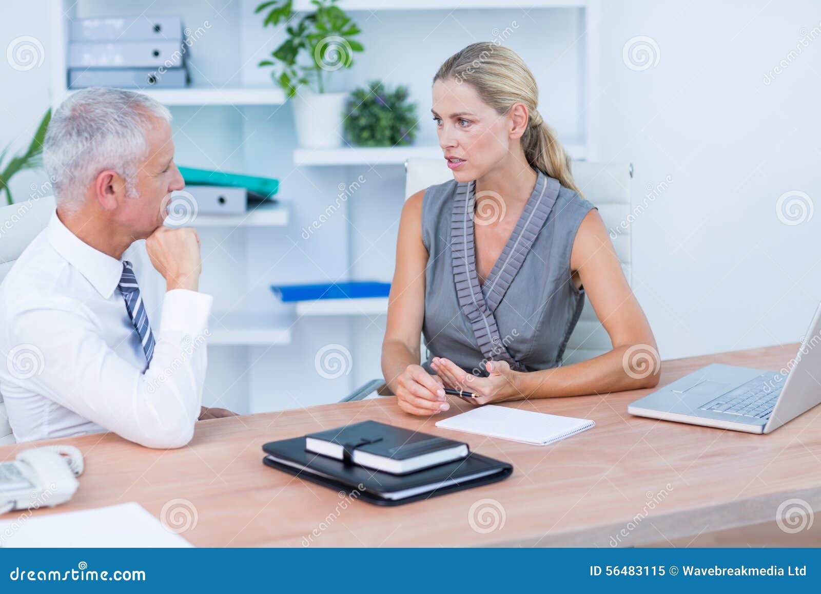 Colleagues Speaking and Working Stock Image - Image of sitting ...