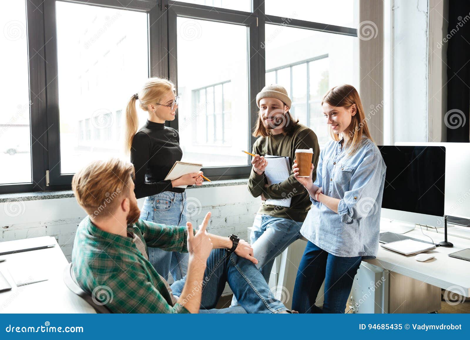 Colleagues Standing in Office and Talking with Each Other Stock Image ...