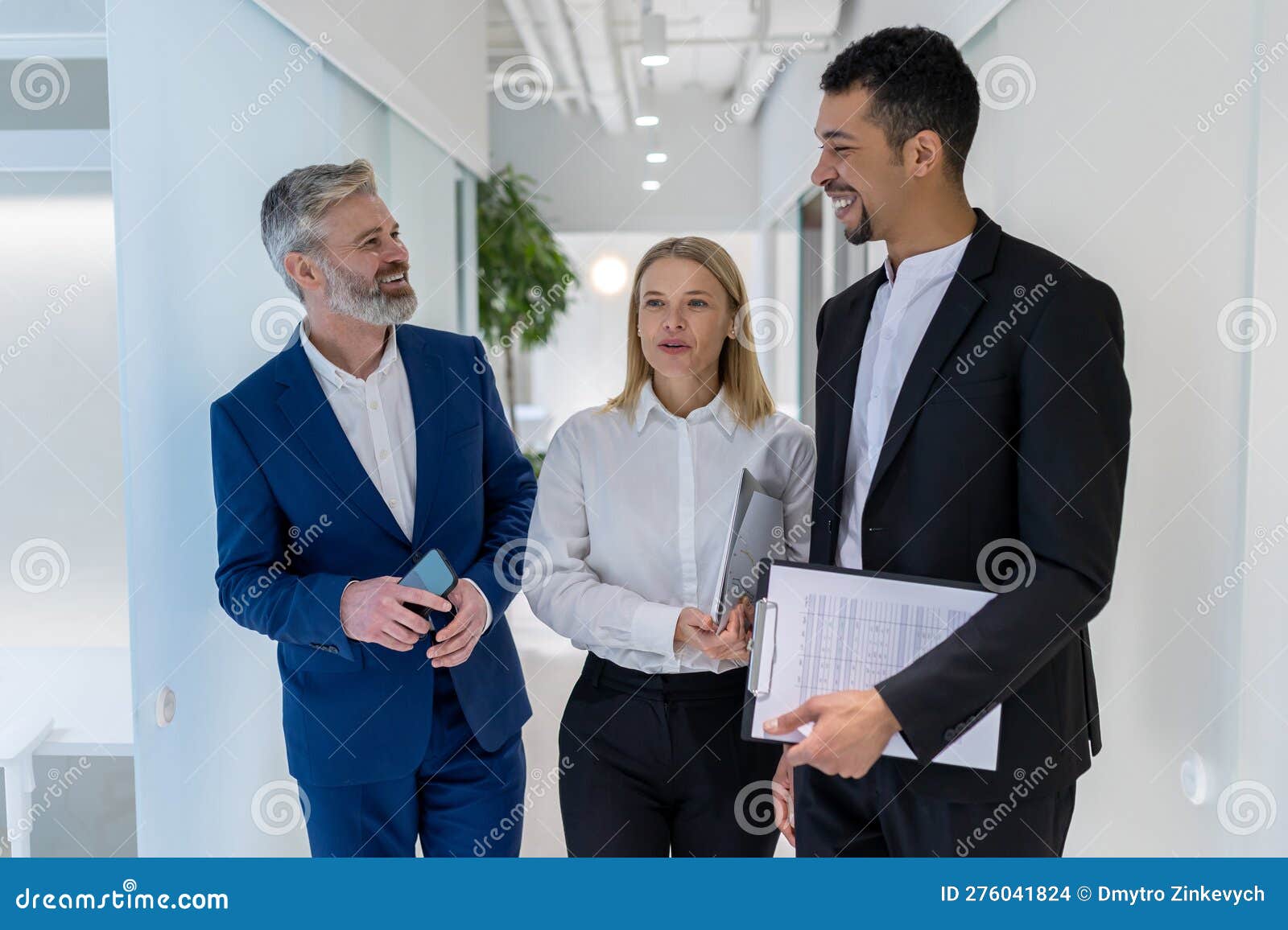 Colleagues Talking after Business Meeting and Looking Involved Stock ...