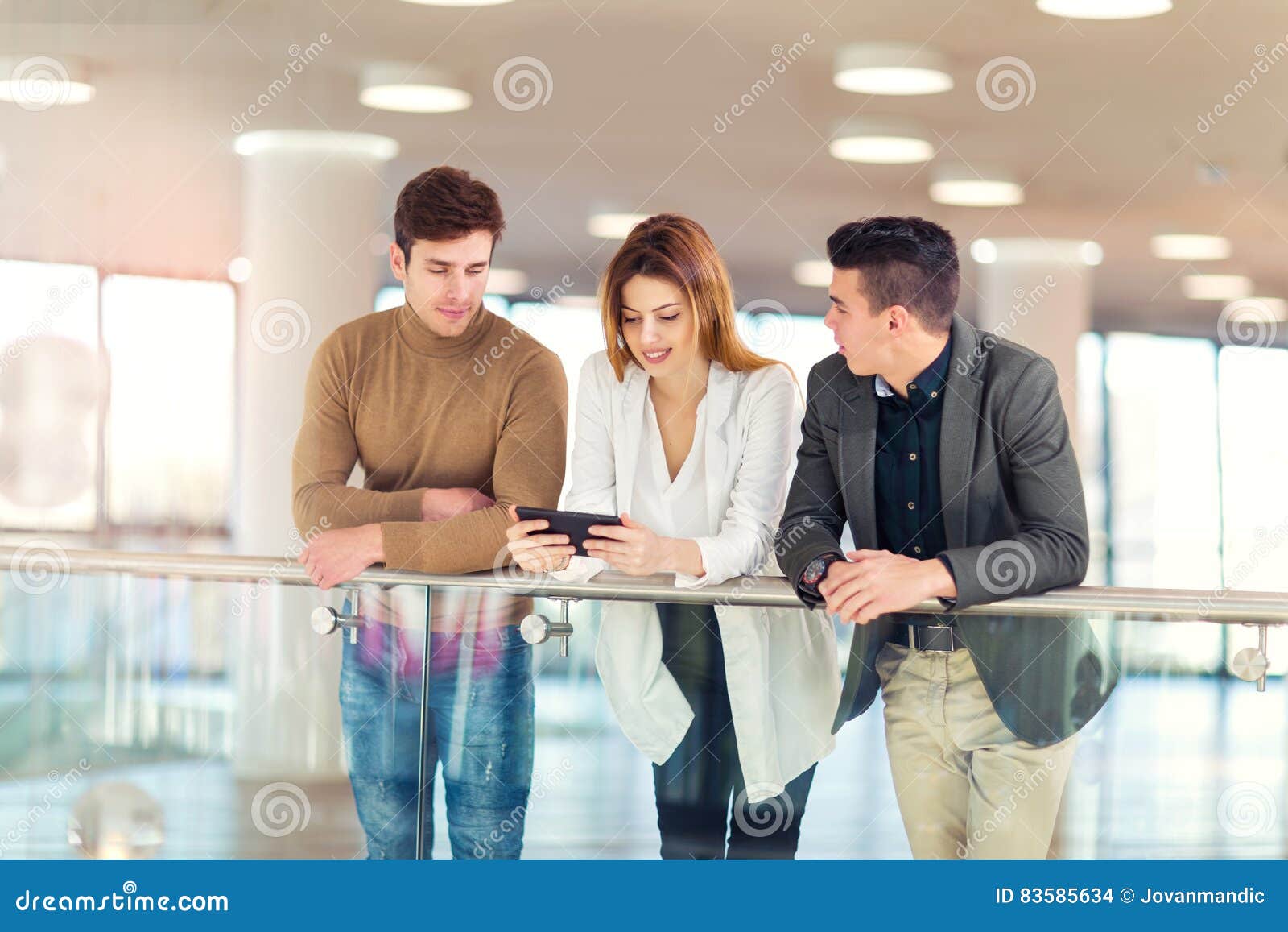 Colleagues Talking in the Hall Office Building Stock Photo - Image of ...