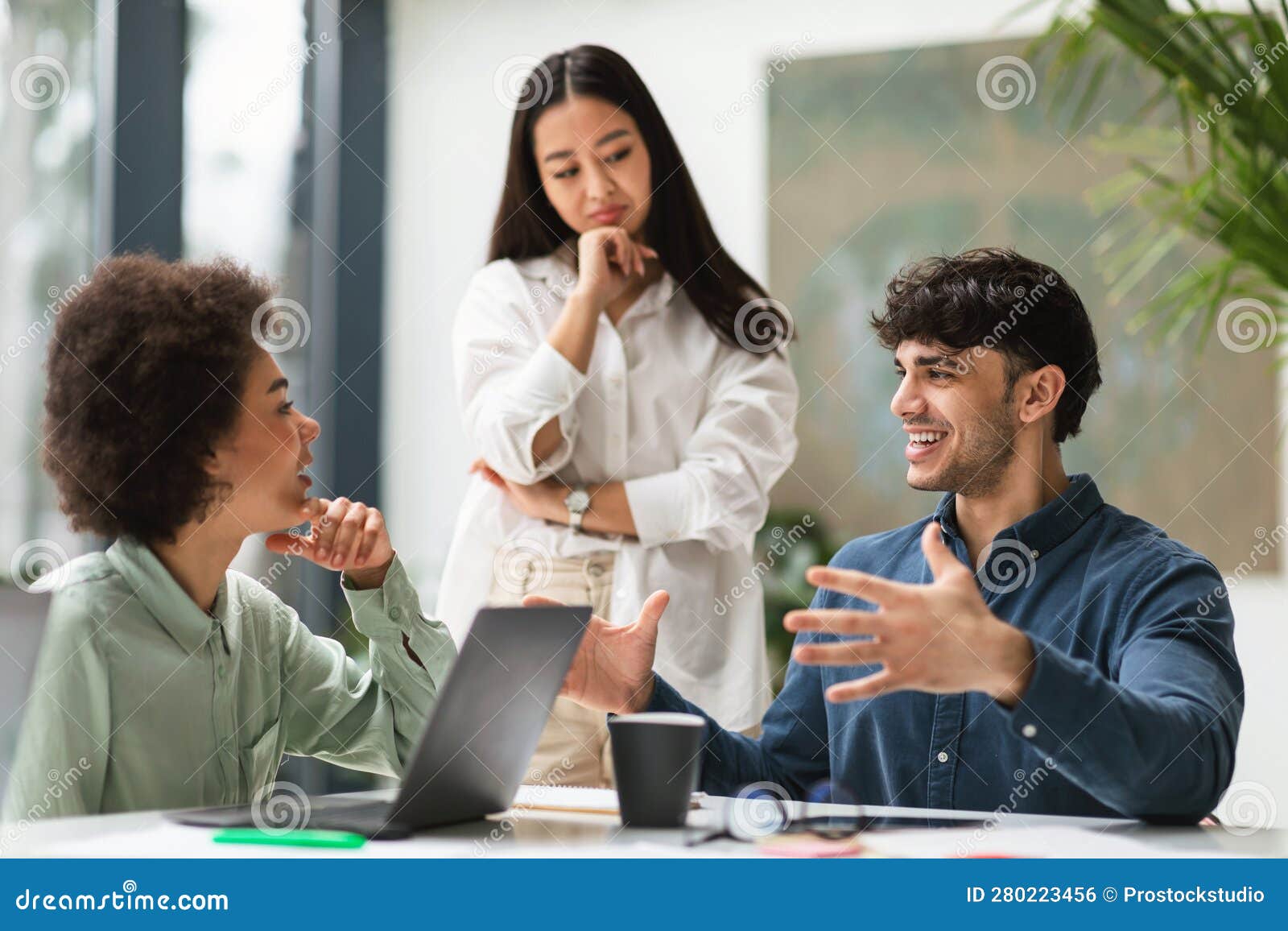 Colleagues Talking Sitting at Laptops during Work Meeting in Office ...