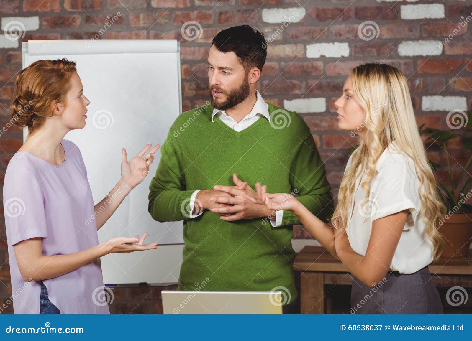 Colleagues Talking about Work in Office Stock Image - Image of business ...