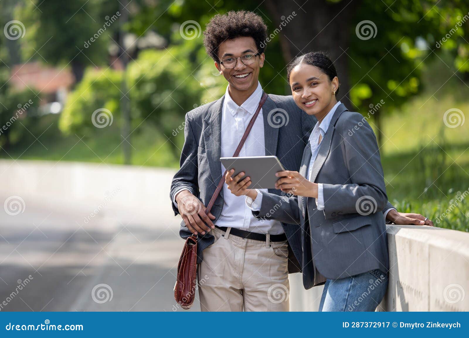 Two Business People with Devices in Hands in the Park Stock Image ...