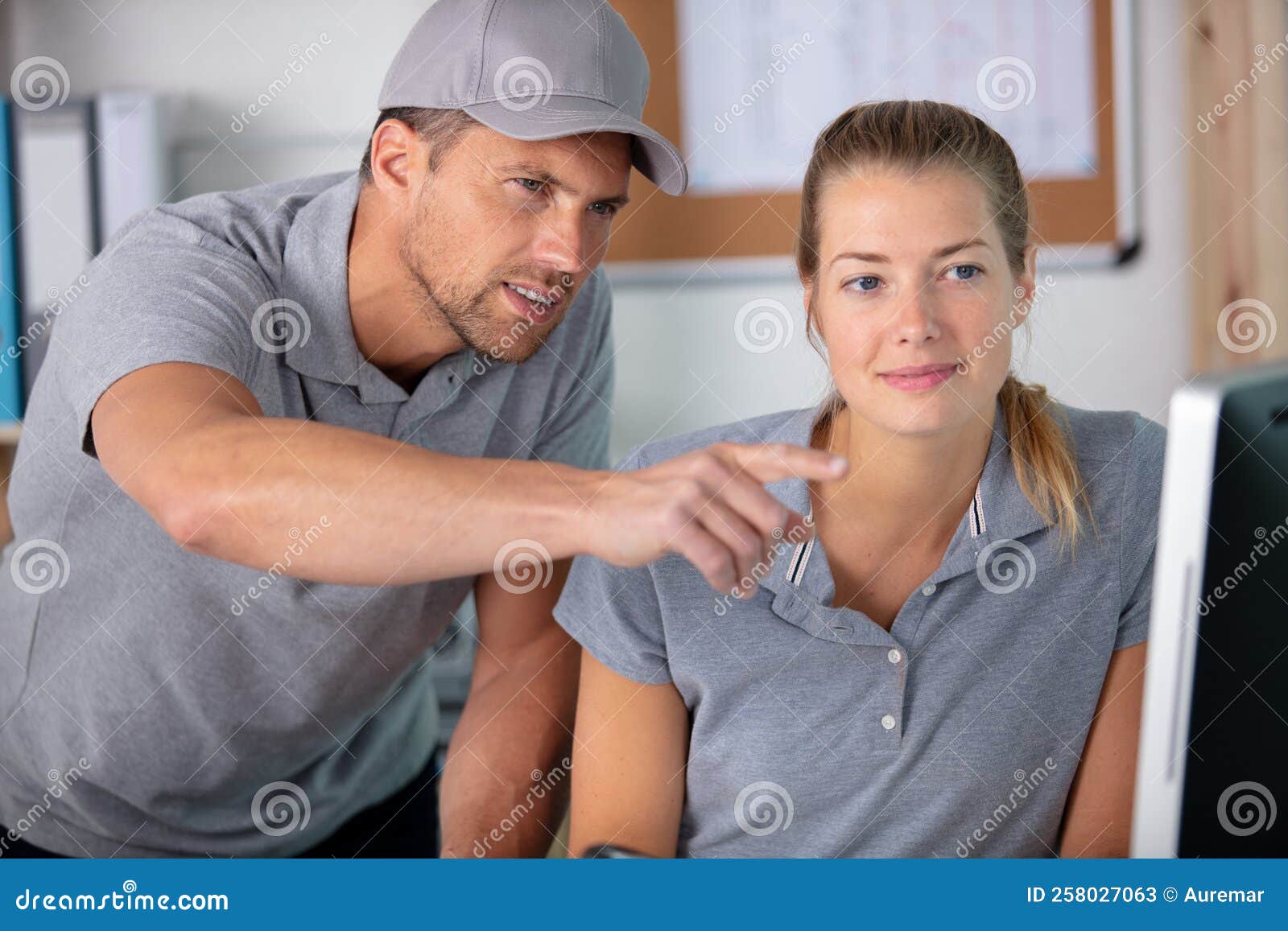 Colleagues in Uniform Looking at Computer Stock Image - Image of teams ...