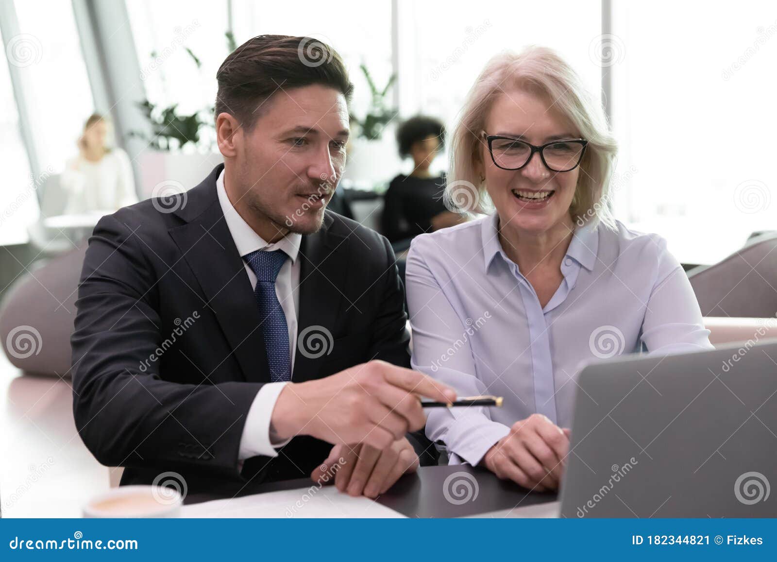 Colleagues Using Computer Discuss Financial Report Data New Application ...