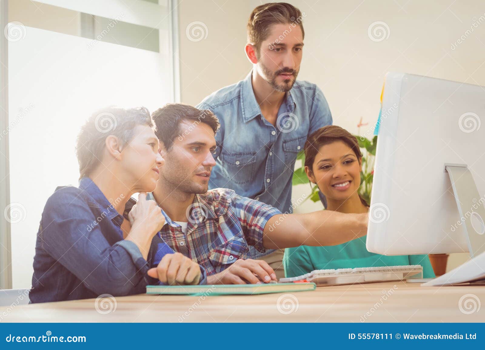 Colleagues Using Laptop at Office Stock Image - Image of businessman ...