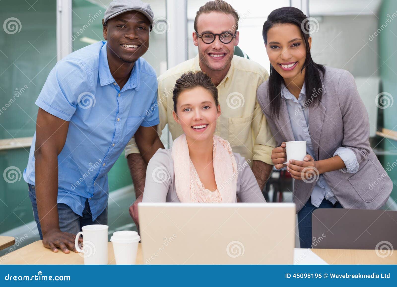 Colleagues Using Laptop at Office Stock Photo - Image of young, black ...