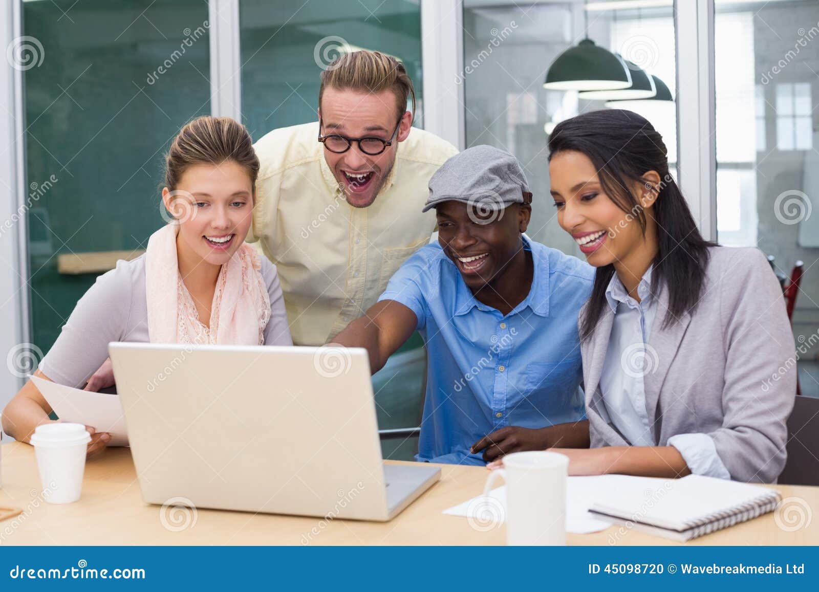 Colleagues Using Laptop at Office Stock Photo - Image of colleagues ...