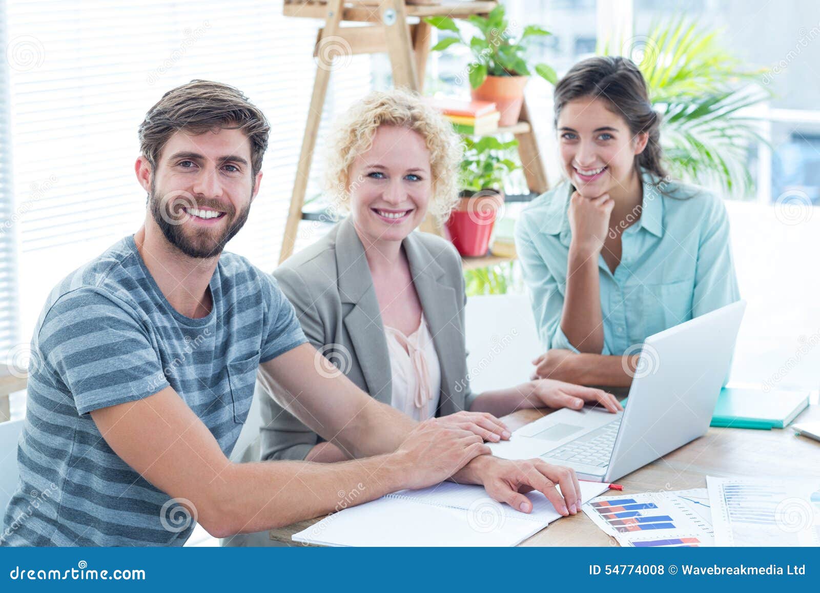 Colleagues Using Laptop at Office Stock Photo - Image of female ...