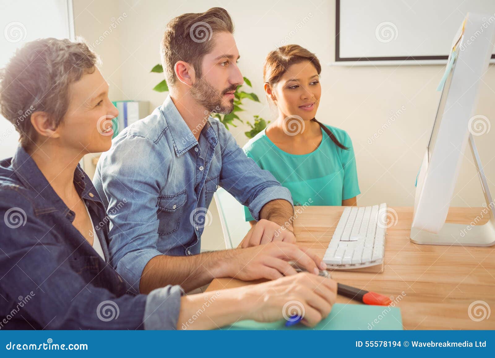 Colleagues Using Laptop at Office Stock Photo - Image of businessman ...