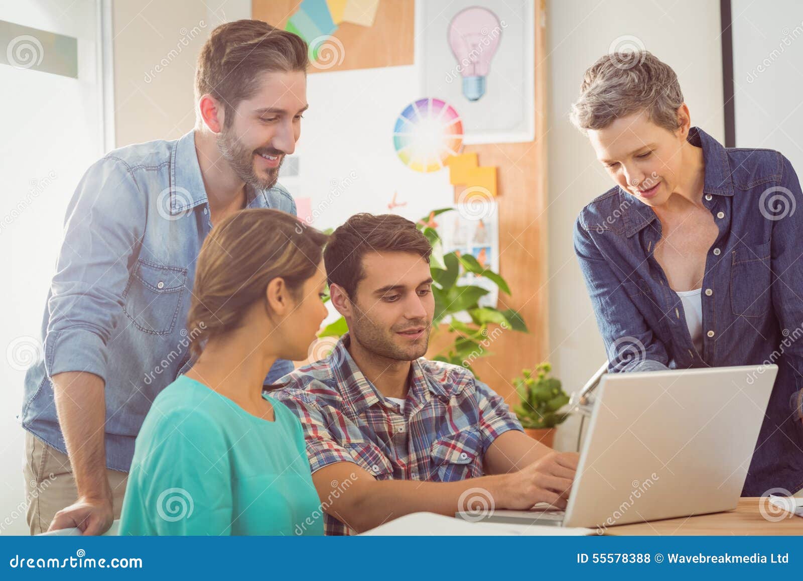 Colleagues Using Laptop at Office Stock Photo - Image of computer ...