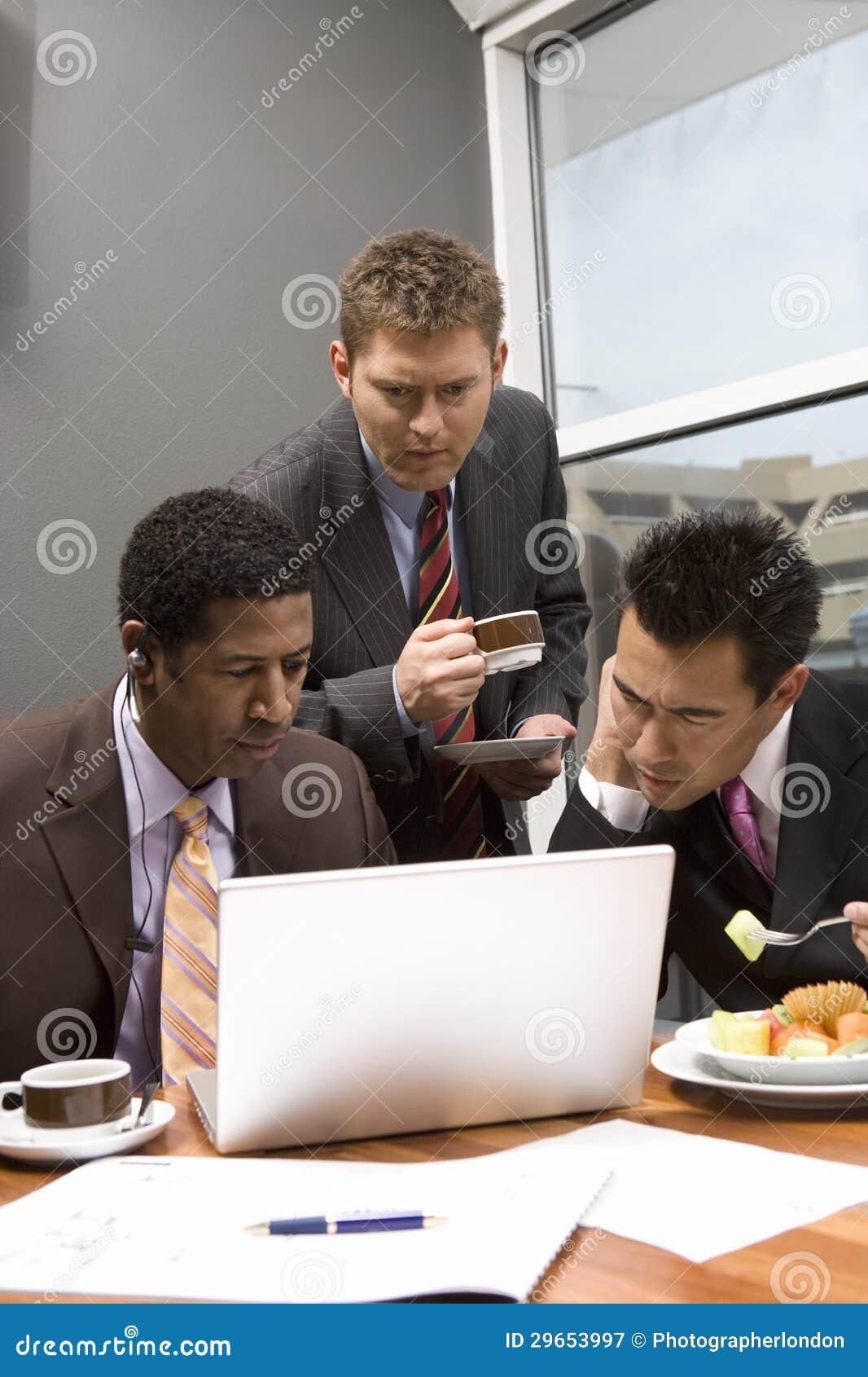 Colleagues Using Laptop during Their Break Stock Image - Image of paper ...
