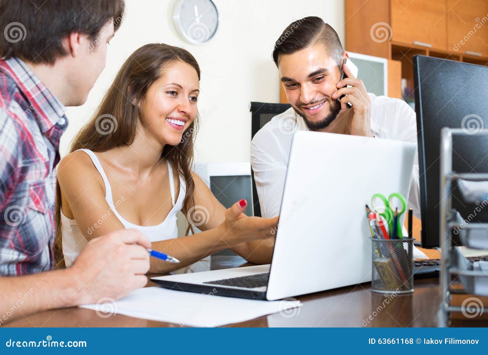 Colleagues Watching at Laptop Stock Photo - Image of technology ...