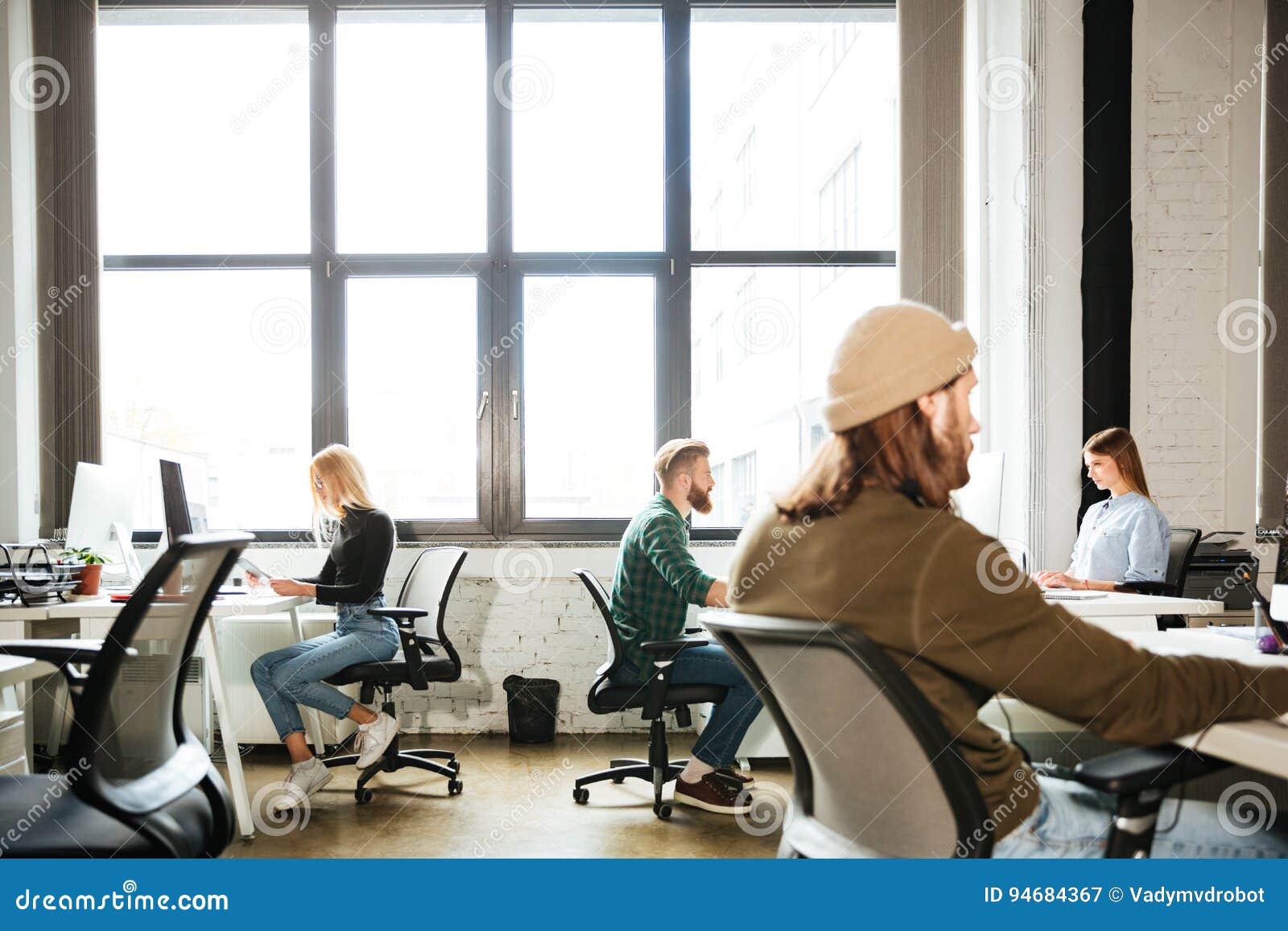 Colleagues Work in Office Using Computers. Looking Aside Stock Image ...
