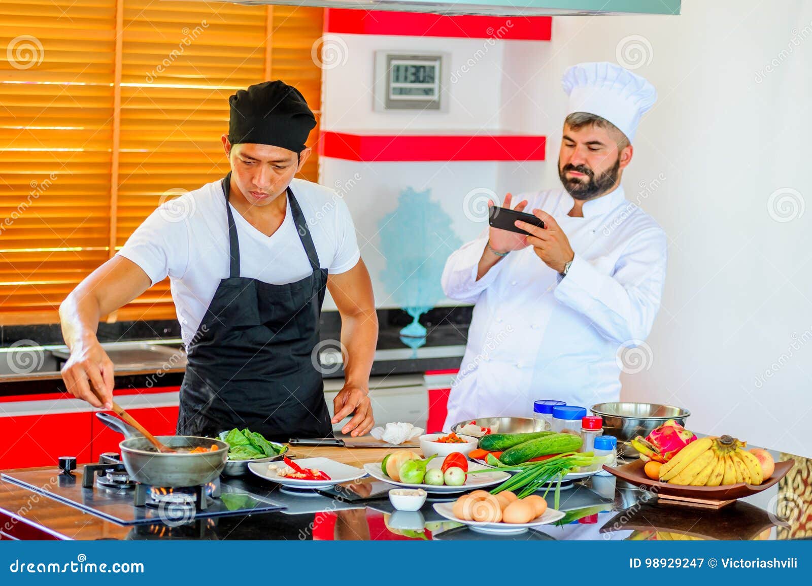Colleagues at Work: Thai and European Chefs at the Kitchen Doing Stock ...