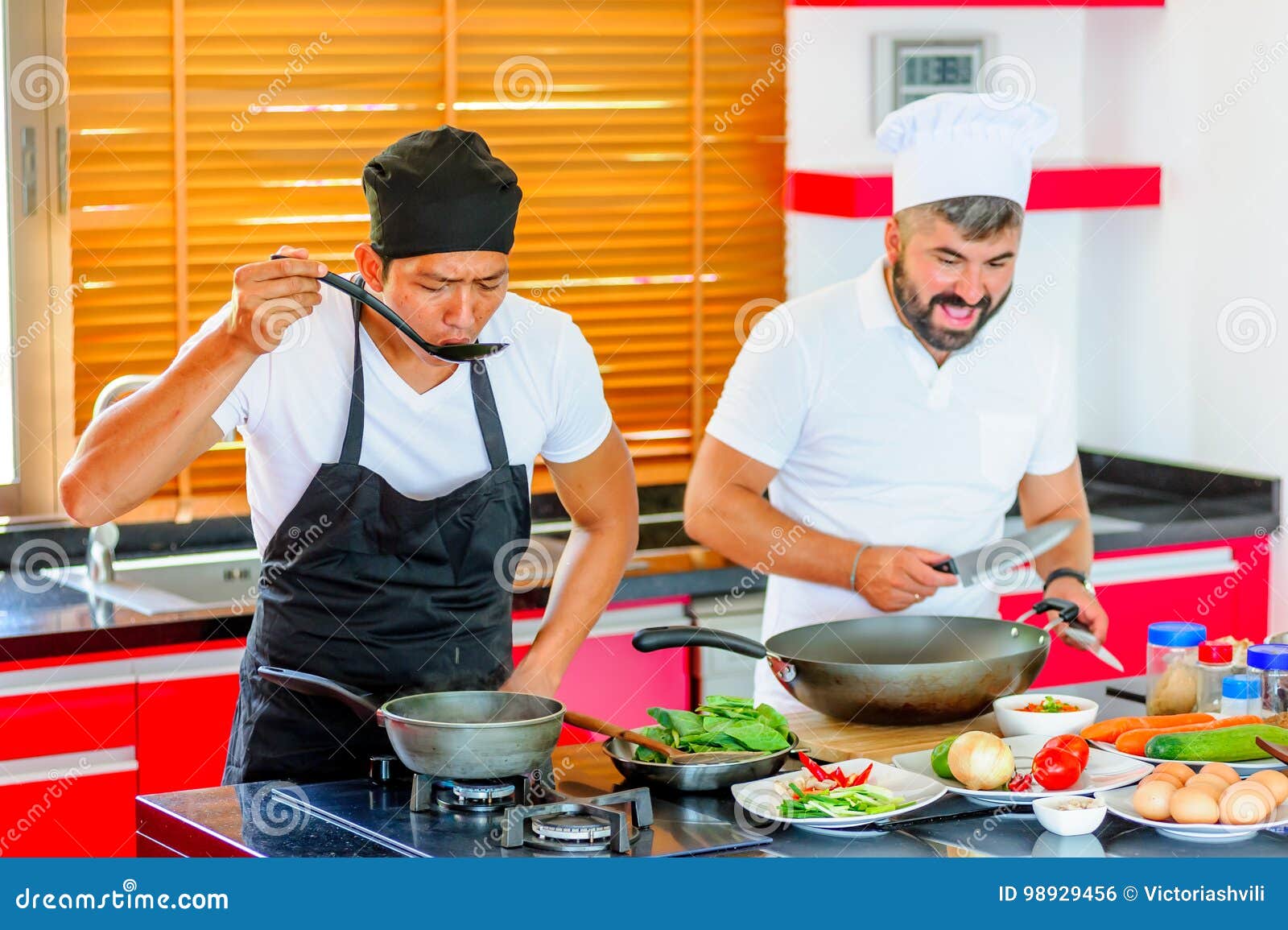 Colleagues at Work: Thai and European Chefs at the Kitchen Doing Stock ...