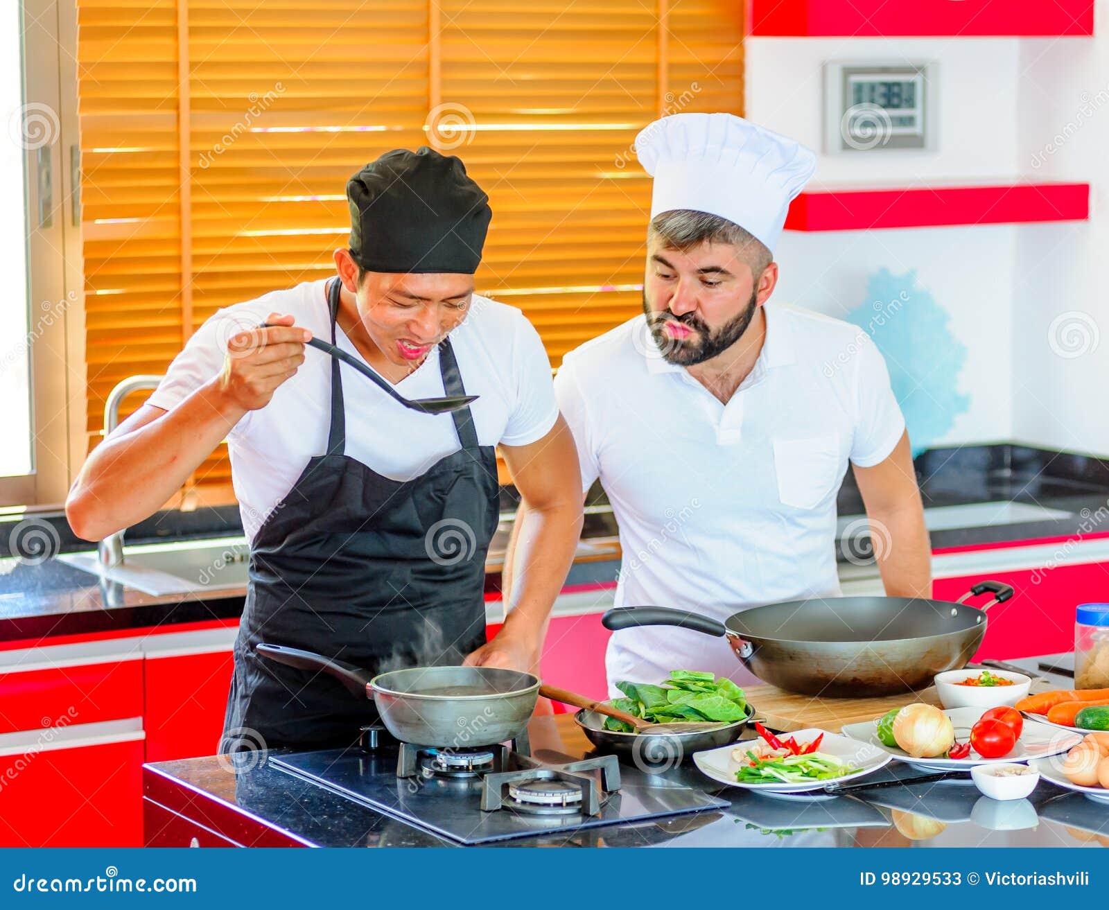 Colleagues at Work: Thai and European Chefs at the Kitchen Doing Stock ...