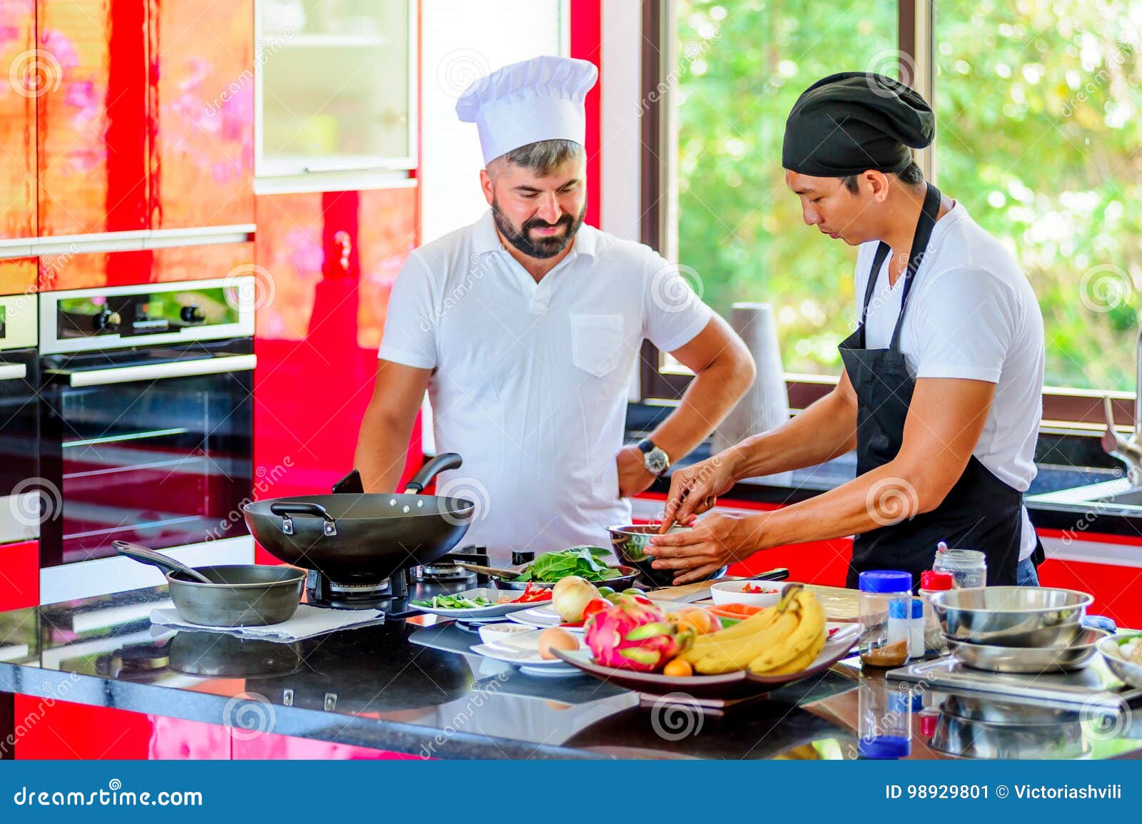 Colleagues at Work: Thai and European Chefs at the Kitchen Doing Stock ...