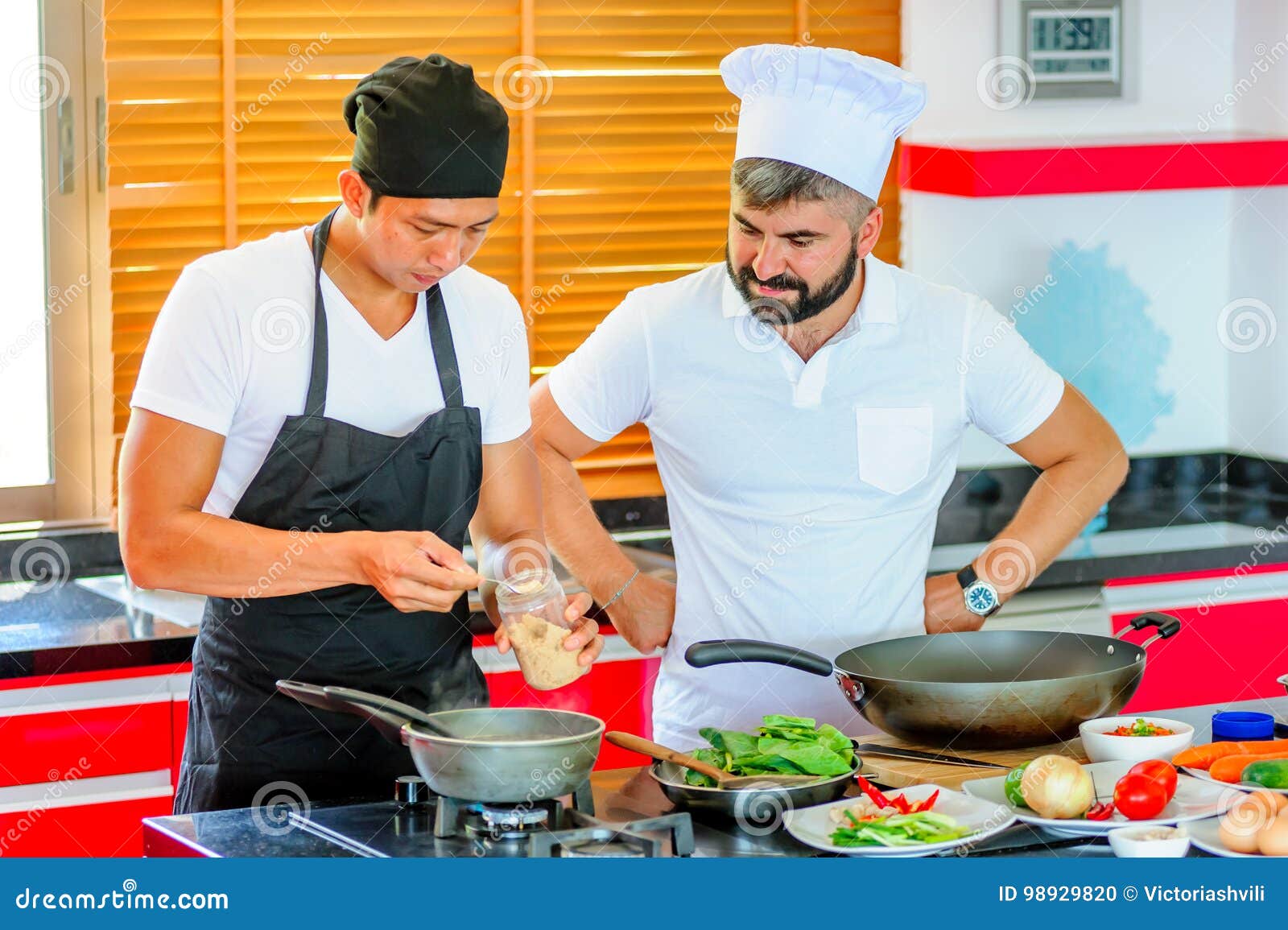 Colleagues at Work: Thai and European Chefs at the Kitchen Doing Stock ...