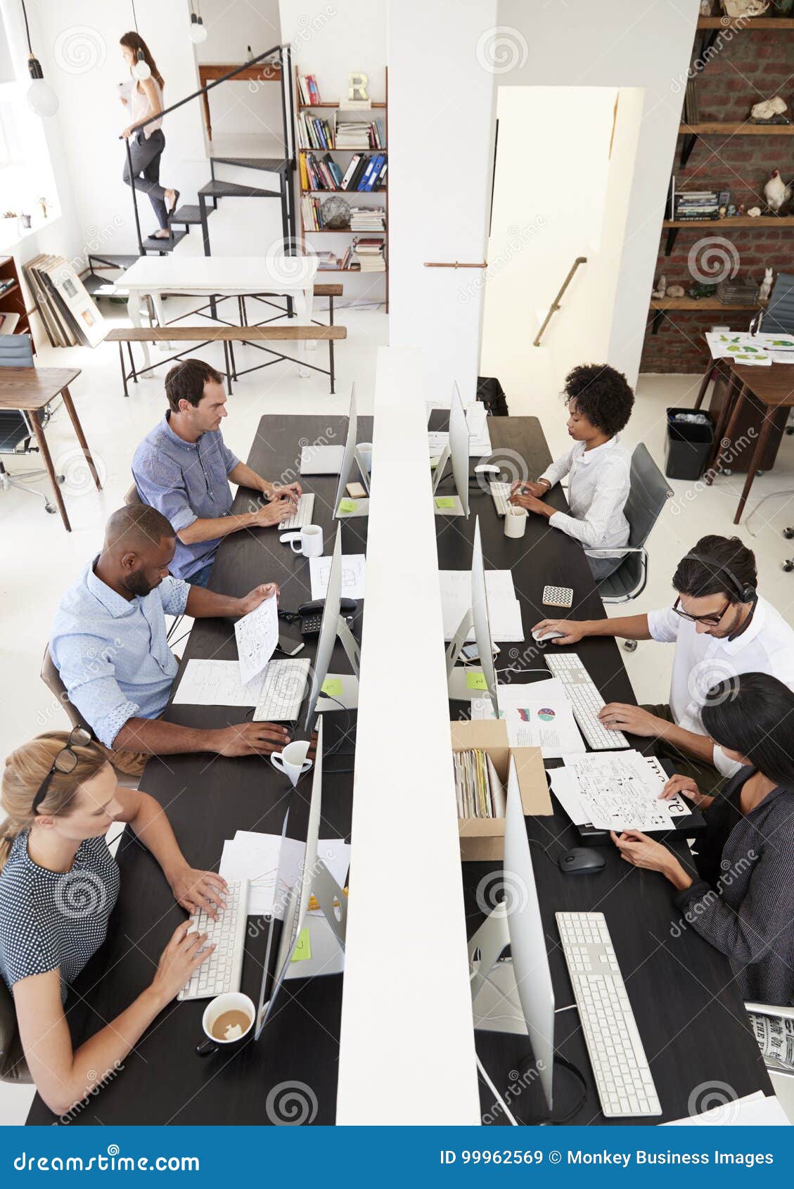 Colleagues Working at a Busy Open Plan Office, Vertical Stock Image ...