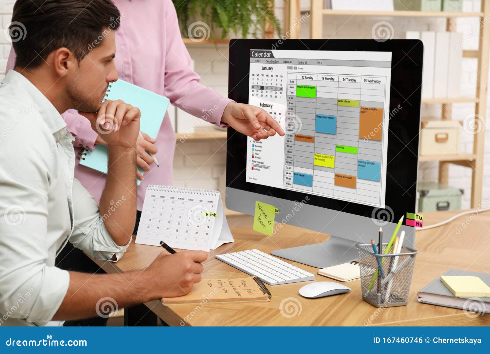 Colleagues Working with Calendar App on Computer Stock Photo - Image of ...