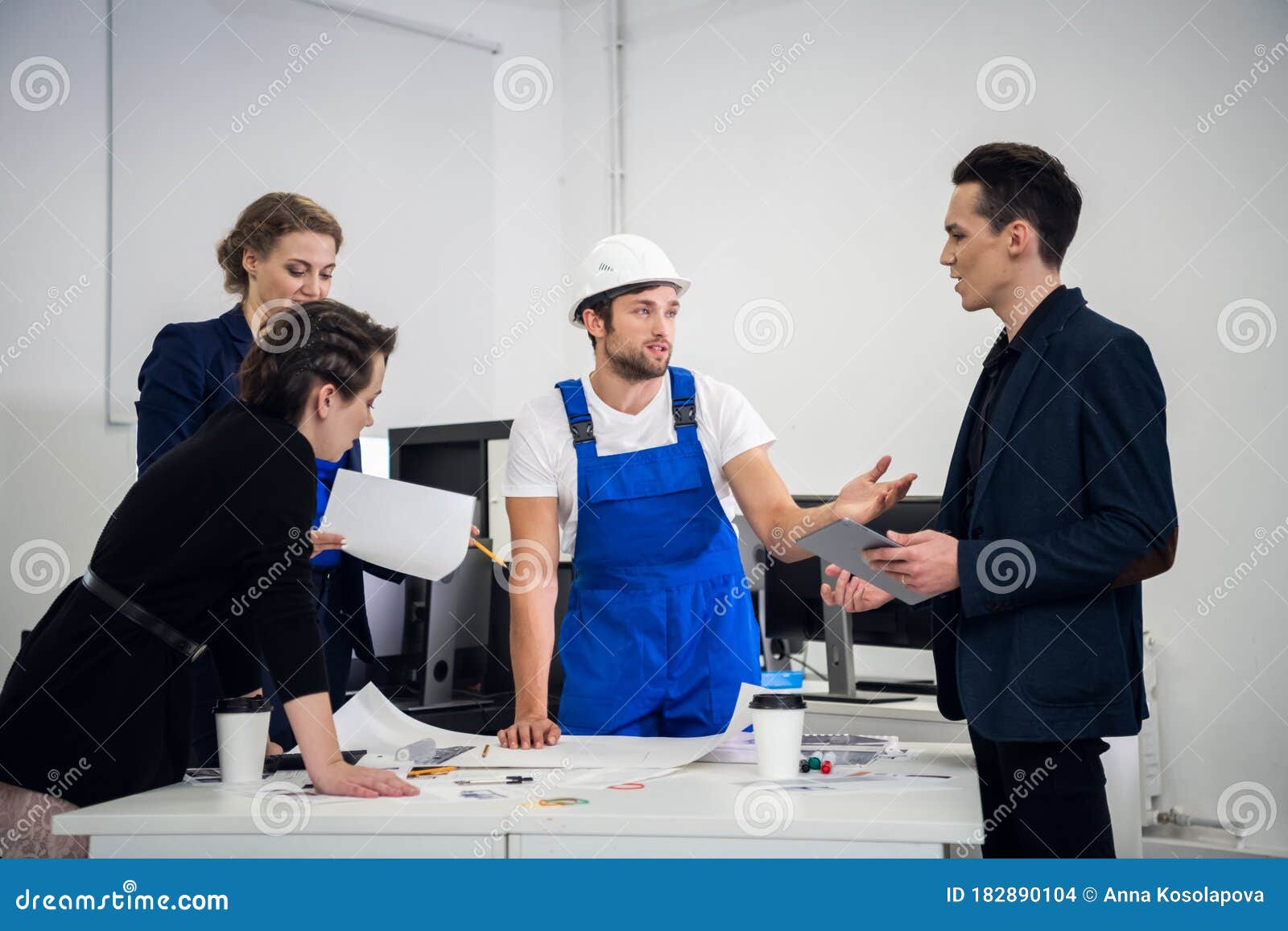 Colleagues Working on a Construction Project Together Stock Photo ...