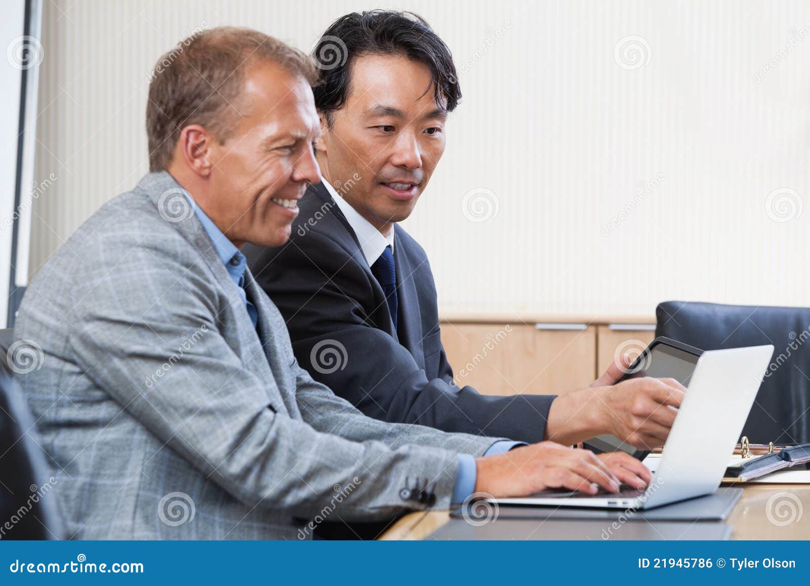 Colleagues Working Together on a Computer Stock Photo - Image of adult ...