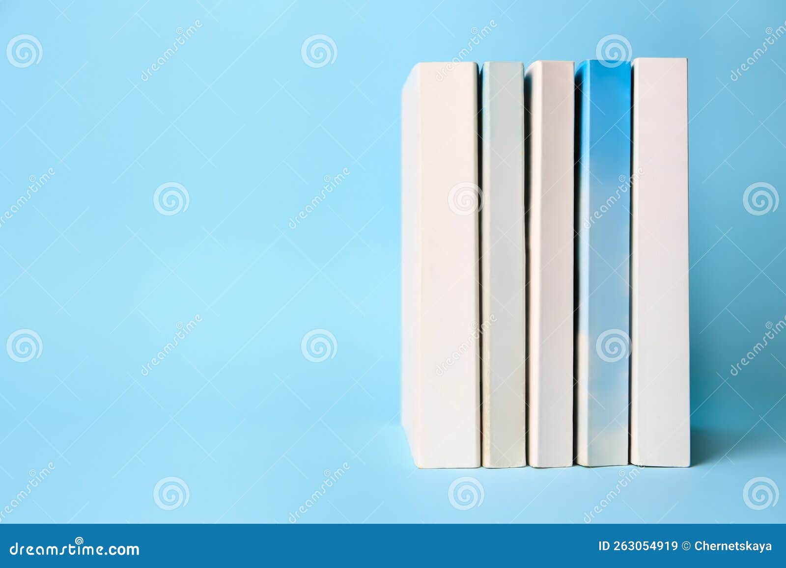 Collection of Books on Light Blue Background, Space for Text Stock ...