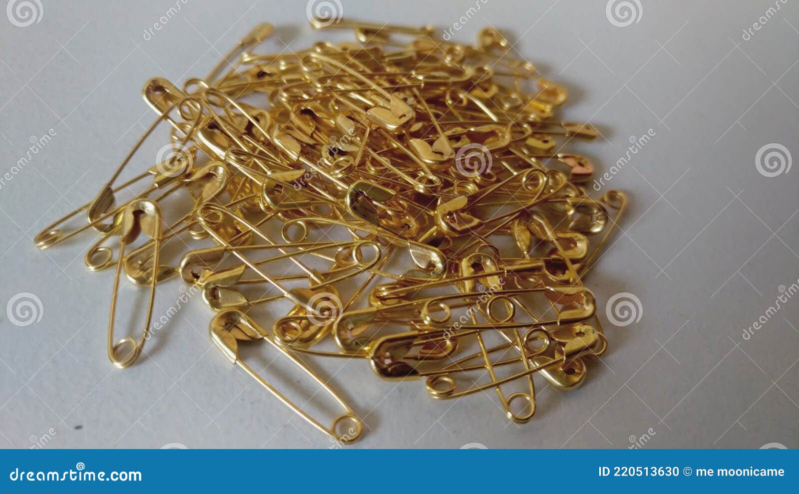 A Collection of Small Gold Safety Pins Stock Photo - Image of pins ...
