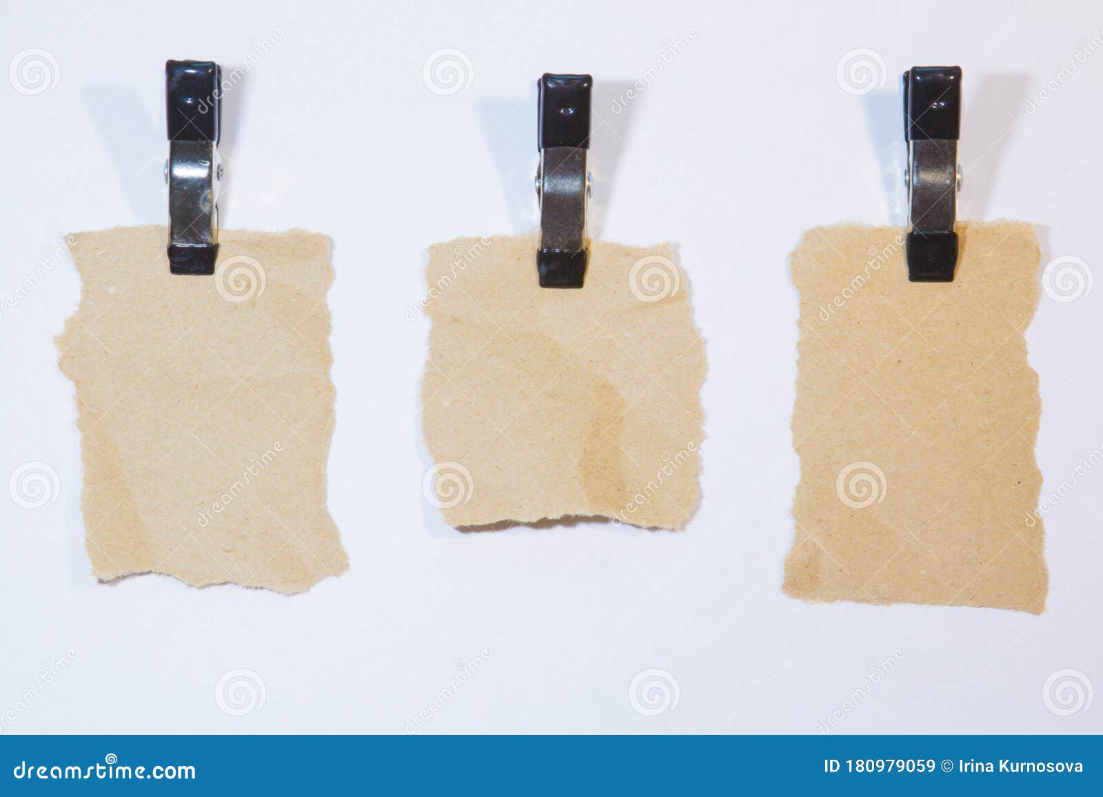 Set of Brown Paper Pieces with Alligator Clippers on the White ...