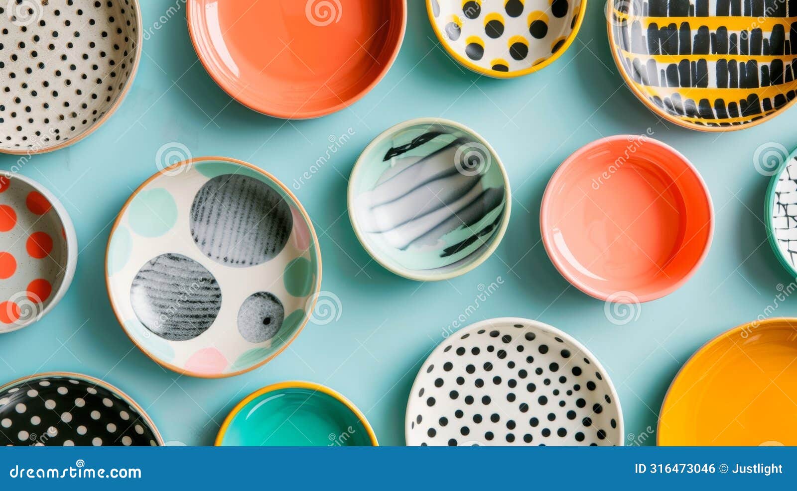A Collection of Ceramic Dishes in a Geometric Pattern with Bold Pops of ...