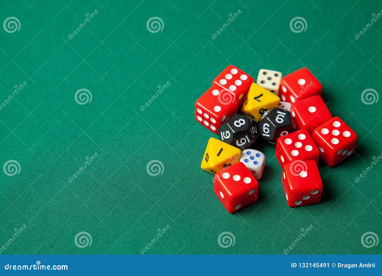 Collection of Colored Gaming Dice Cubes on Green Table. Copy Space for ...