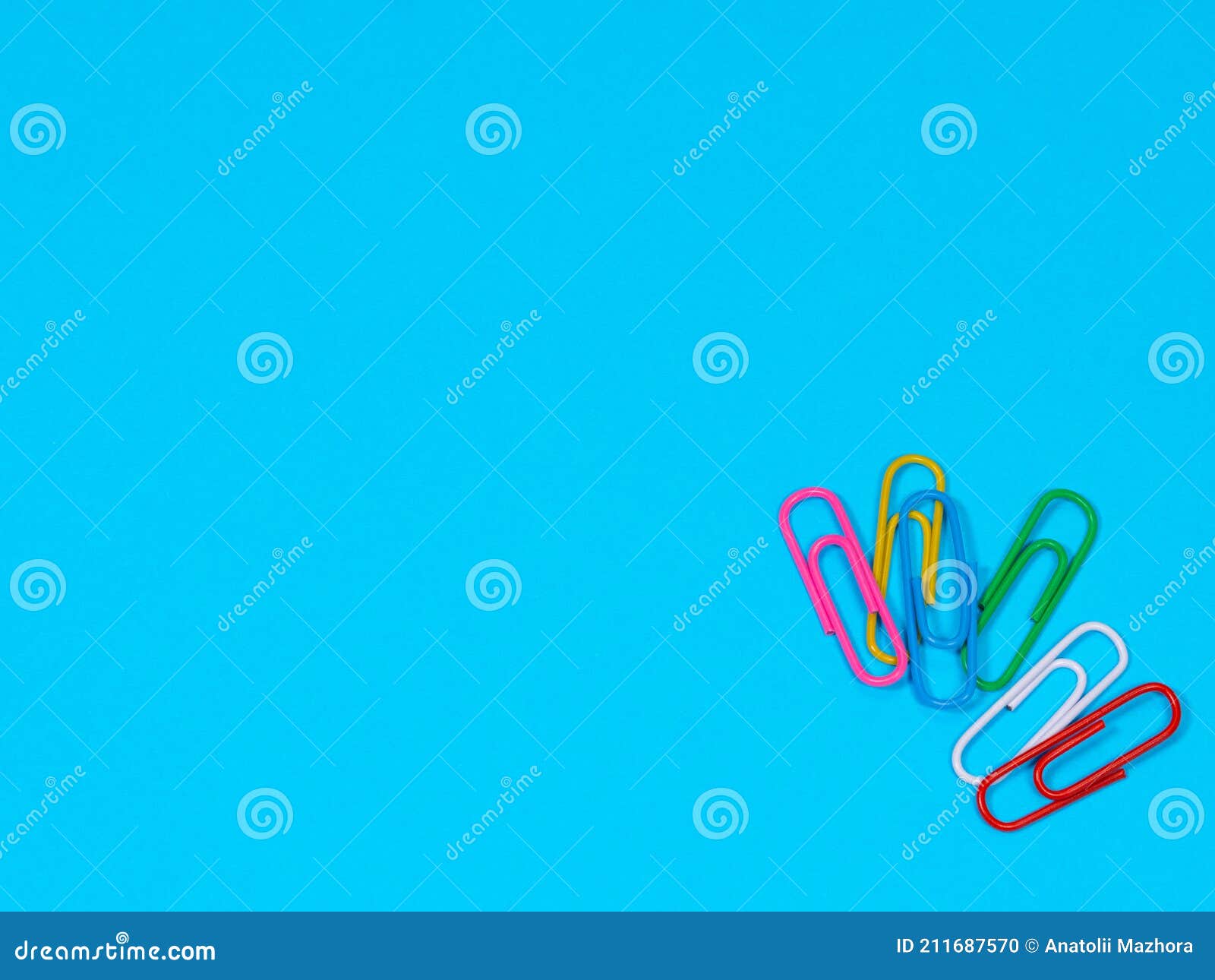 Collection of Colorful Paper Clips on Blue Background Stock Photo ...