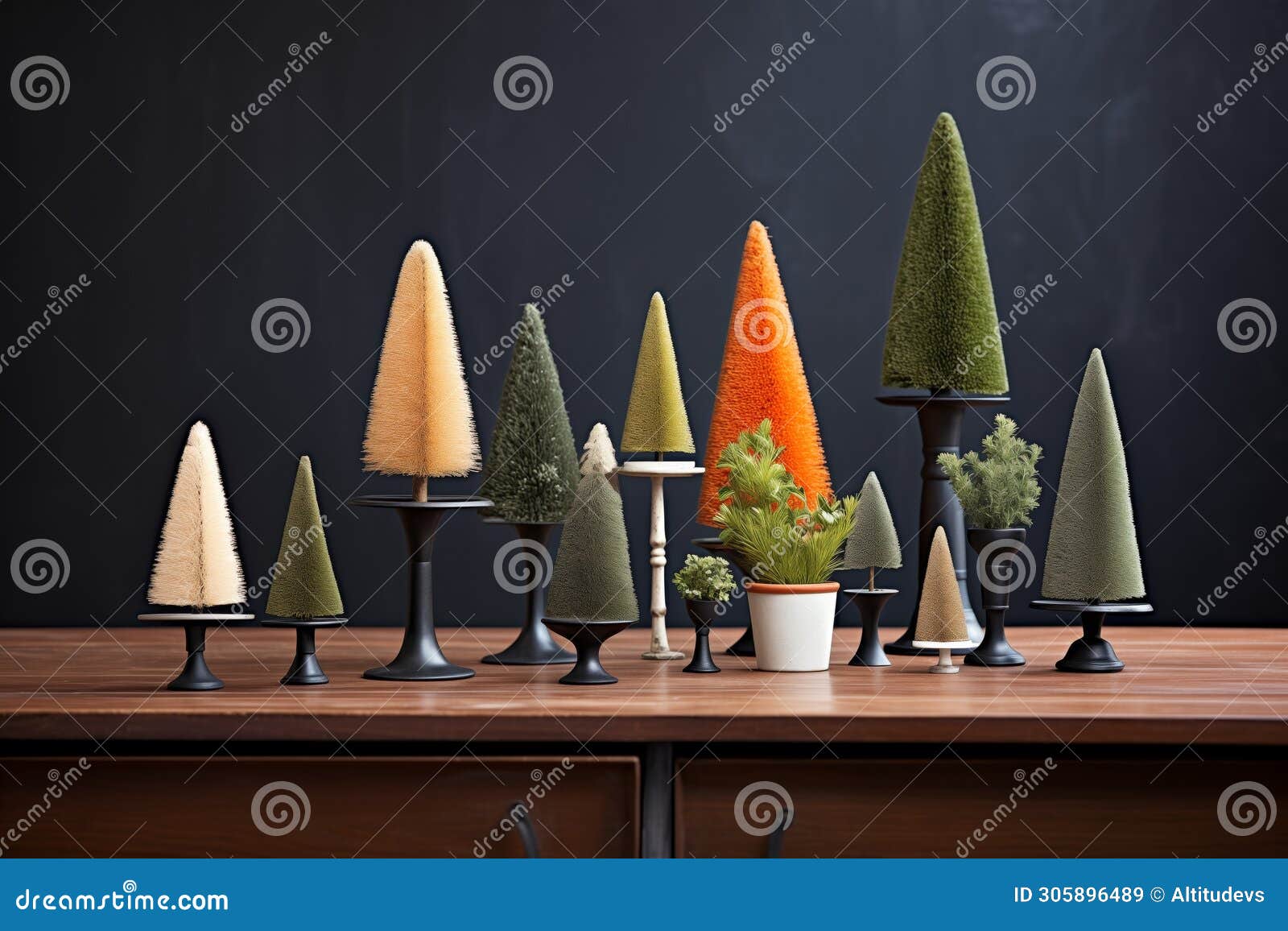 A Collection of Conical Mini Topiaries on a Black Table Stock Image ...