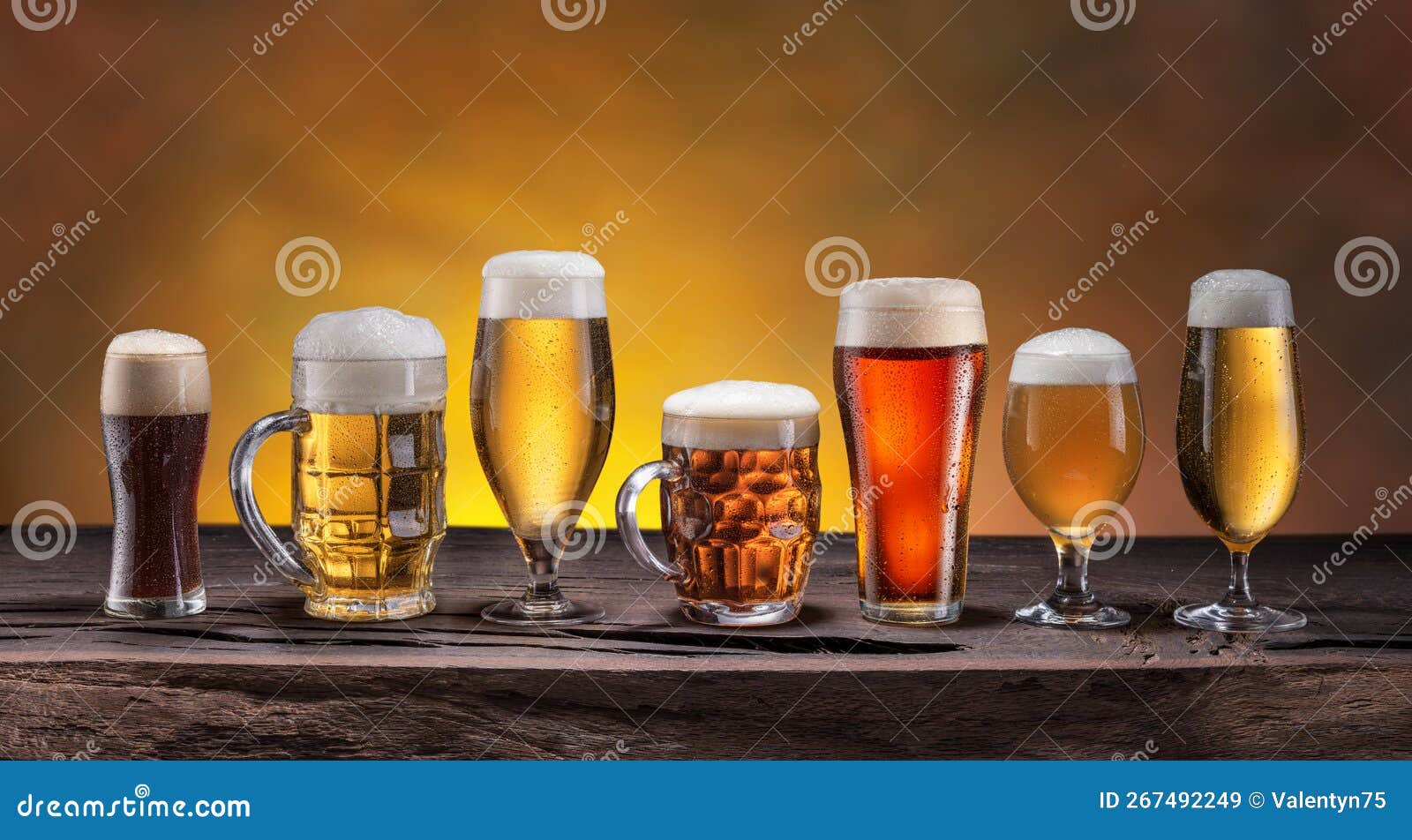 Collection of Different Beer Glasses and Beer Types on Old Wooden Table ...