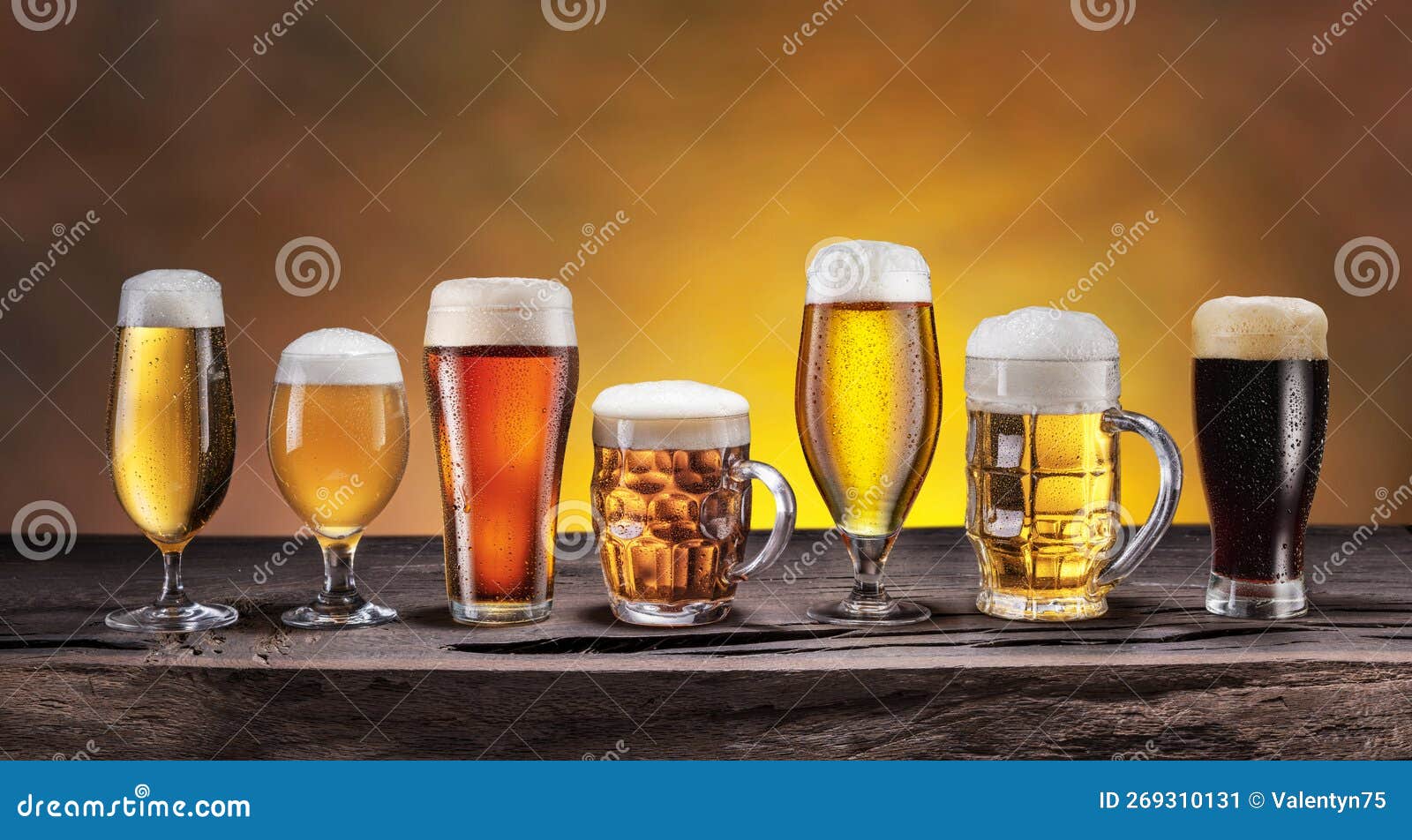 Collection of Different Beer Glasses and Beer Types on Old Wooden Table ...
