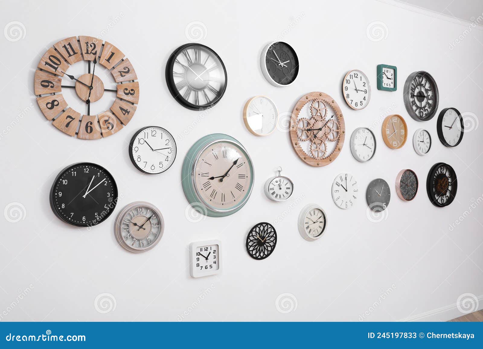Collection of Different Clocks Hanging on White Wall Stock Image ...
