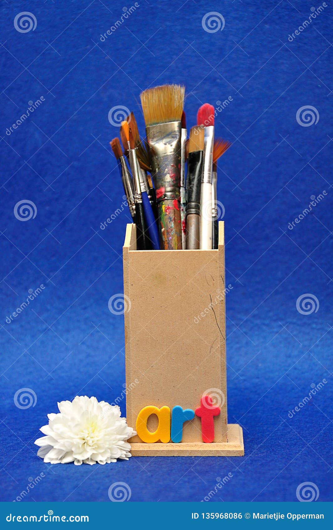 A Collection of Different Size Paint Brushes in a Wooden Container with ...