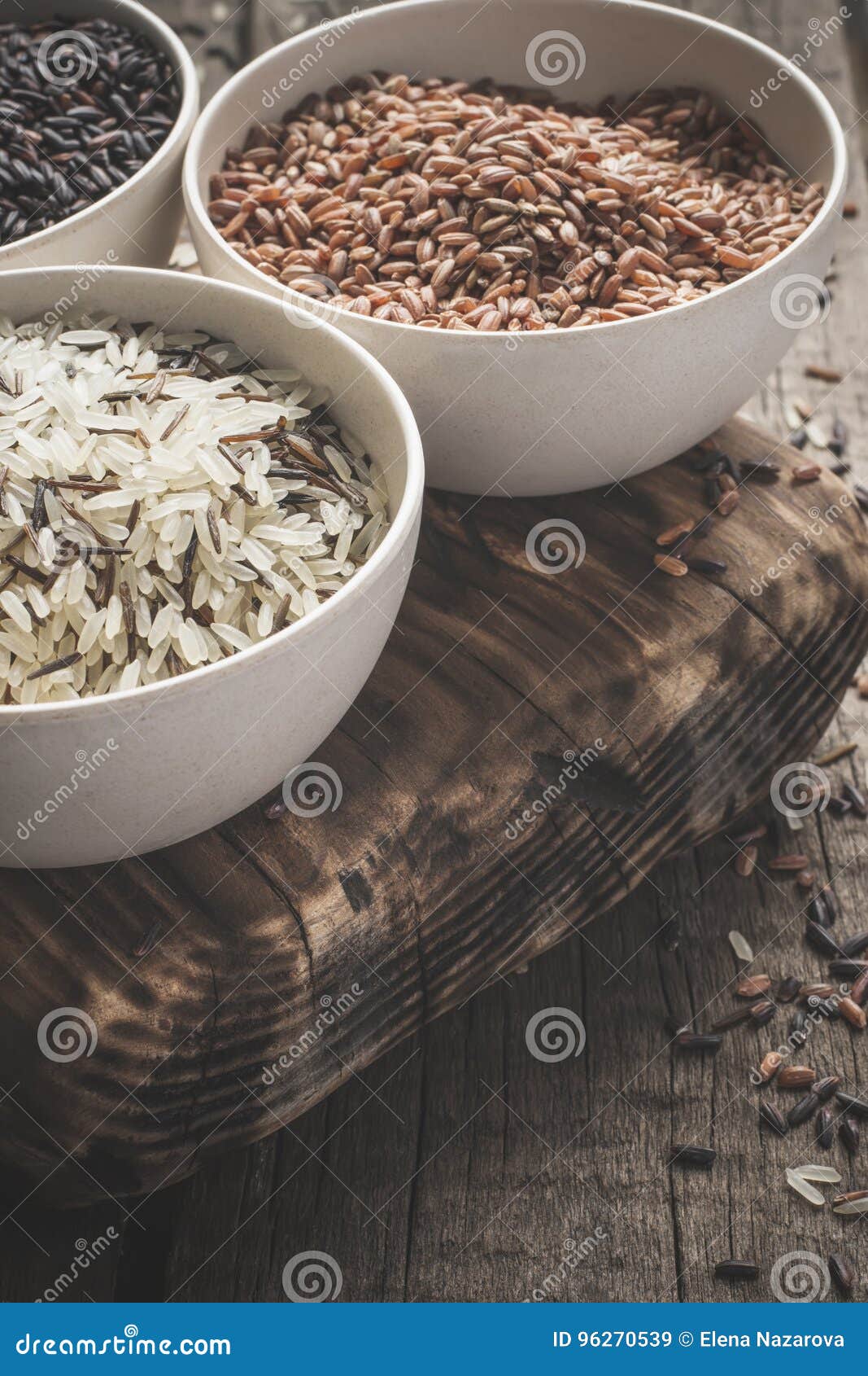 Collection of Different Varieties of Rice on Wooden Rustic Background ...