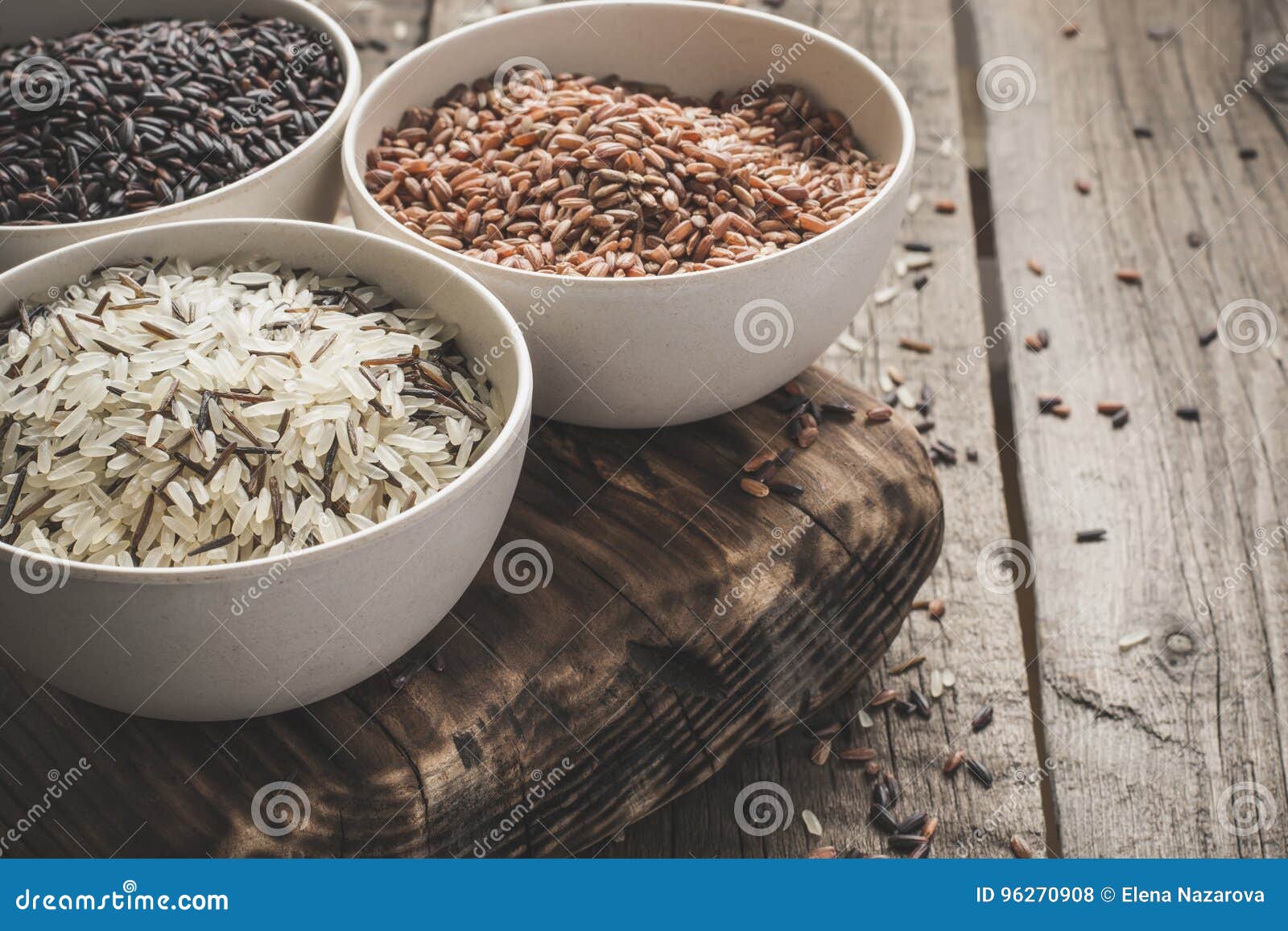Collection of Different Varieties of Rice on Wooden Rustic Background ...