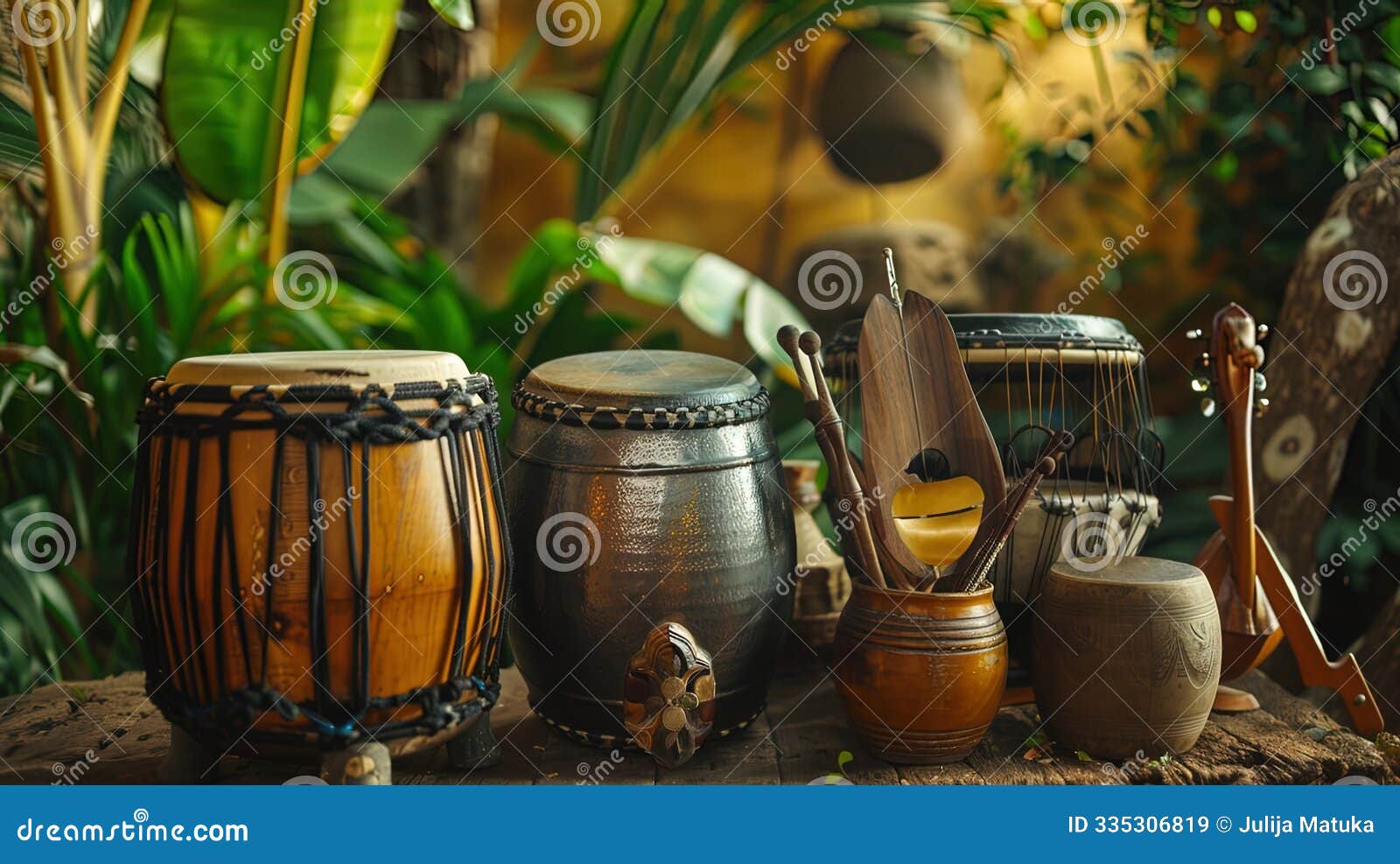 A Collection of Drums and Other Instruments are Displayed on a Table ...