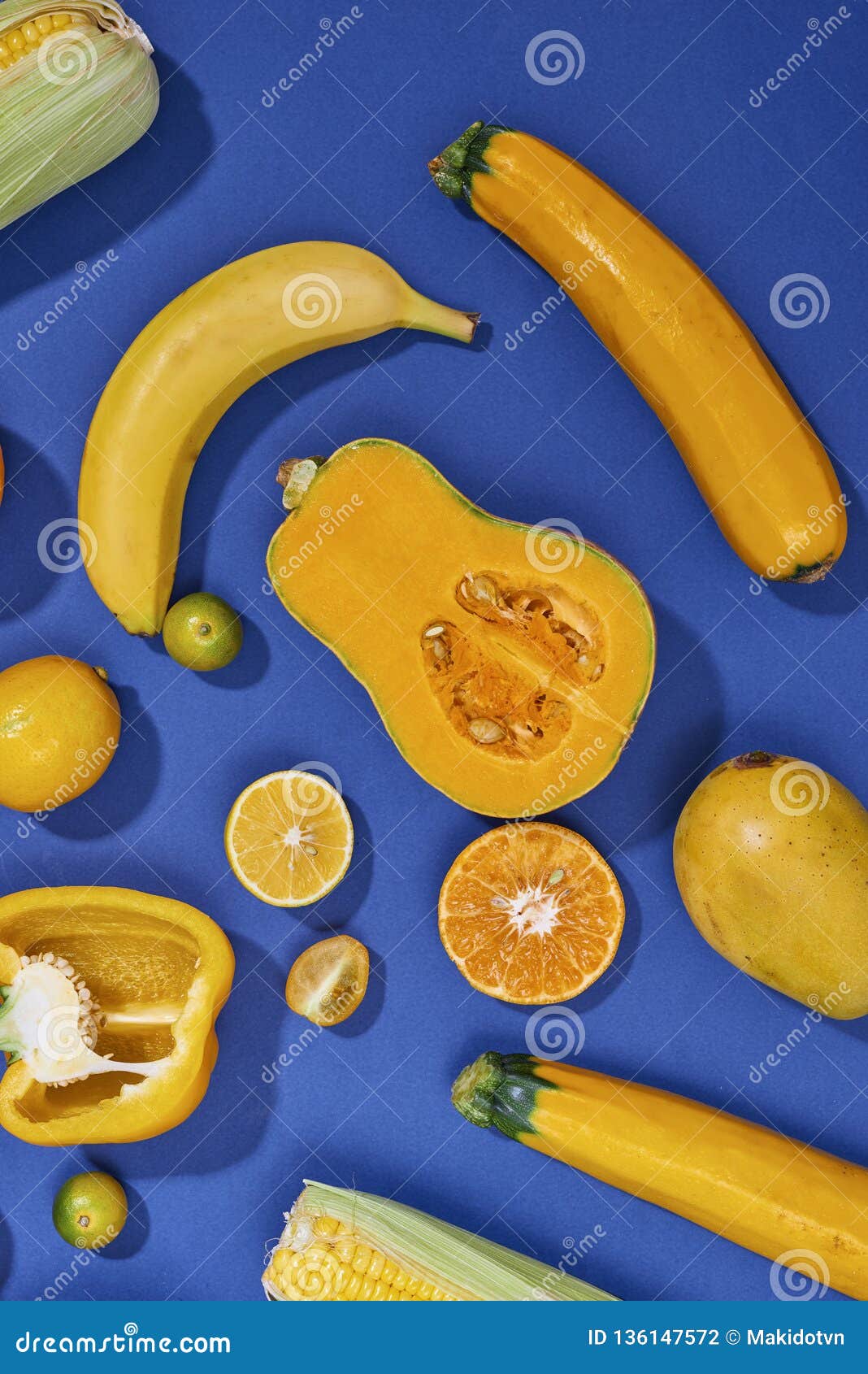 Collection of Fresh Yellow Fruit and Vegetables on the Blue Background ...
