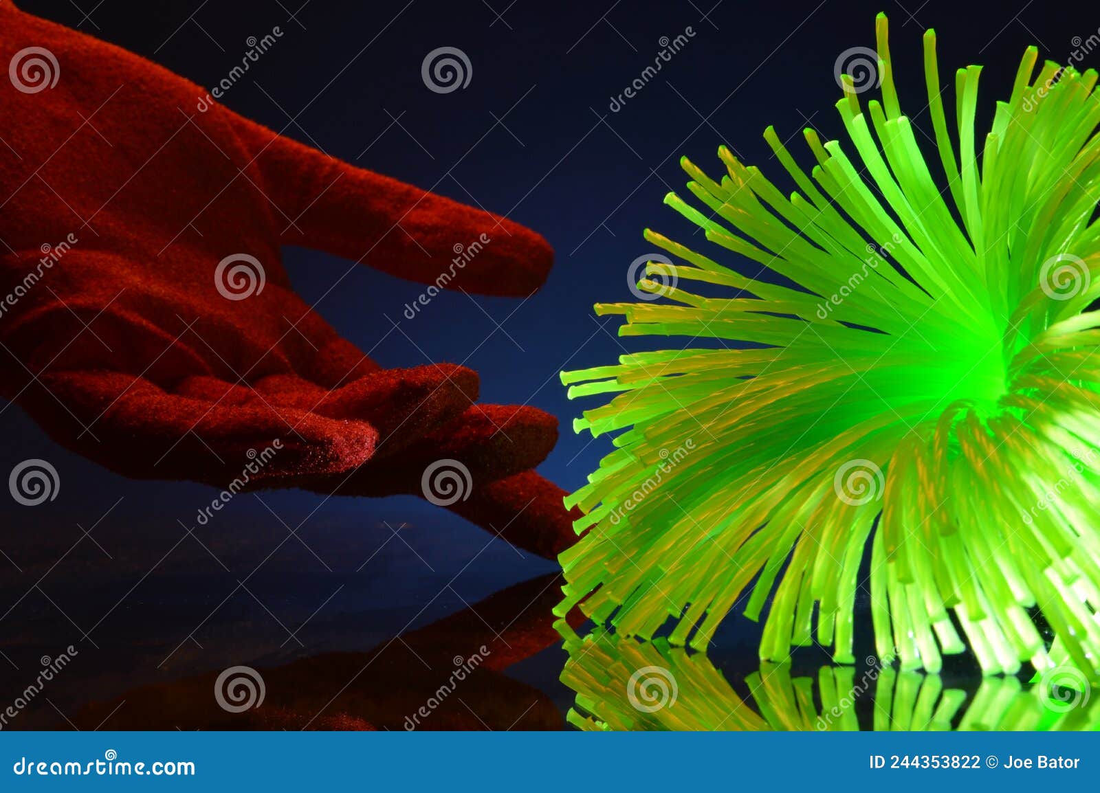 Illuminated Strands of Neon String and Red Glove Stock Photo - Image of ...