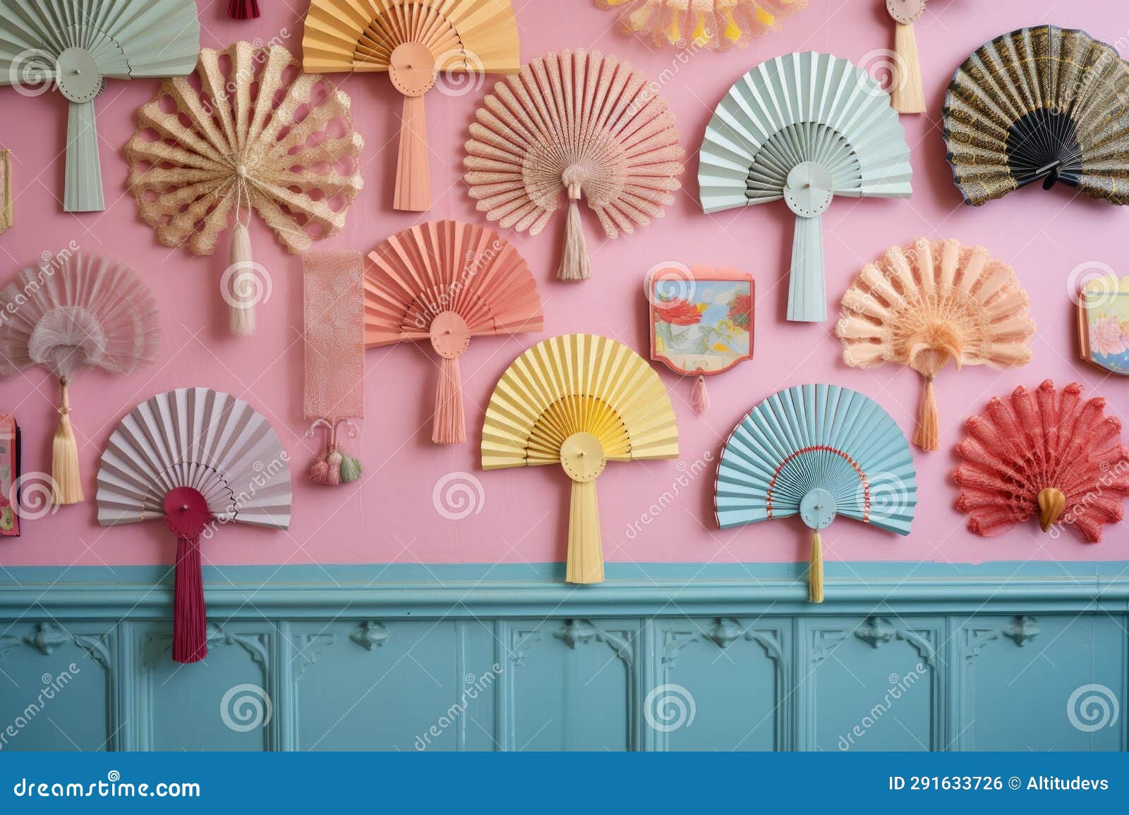 A Collection of Hand Fans Hanging on a Pastel-colored Wall Stock Photo ...