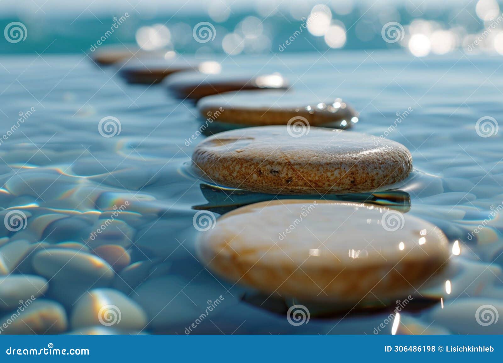 A Row of Rocks Stacked on Top of Each Other in the Water Stock Photo ...