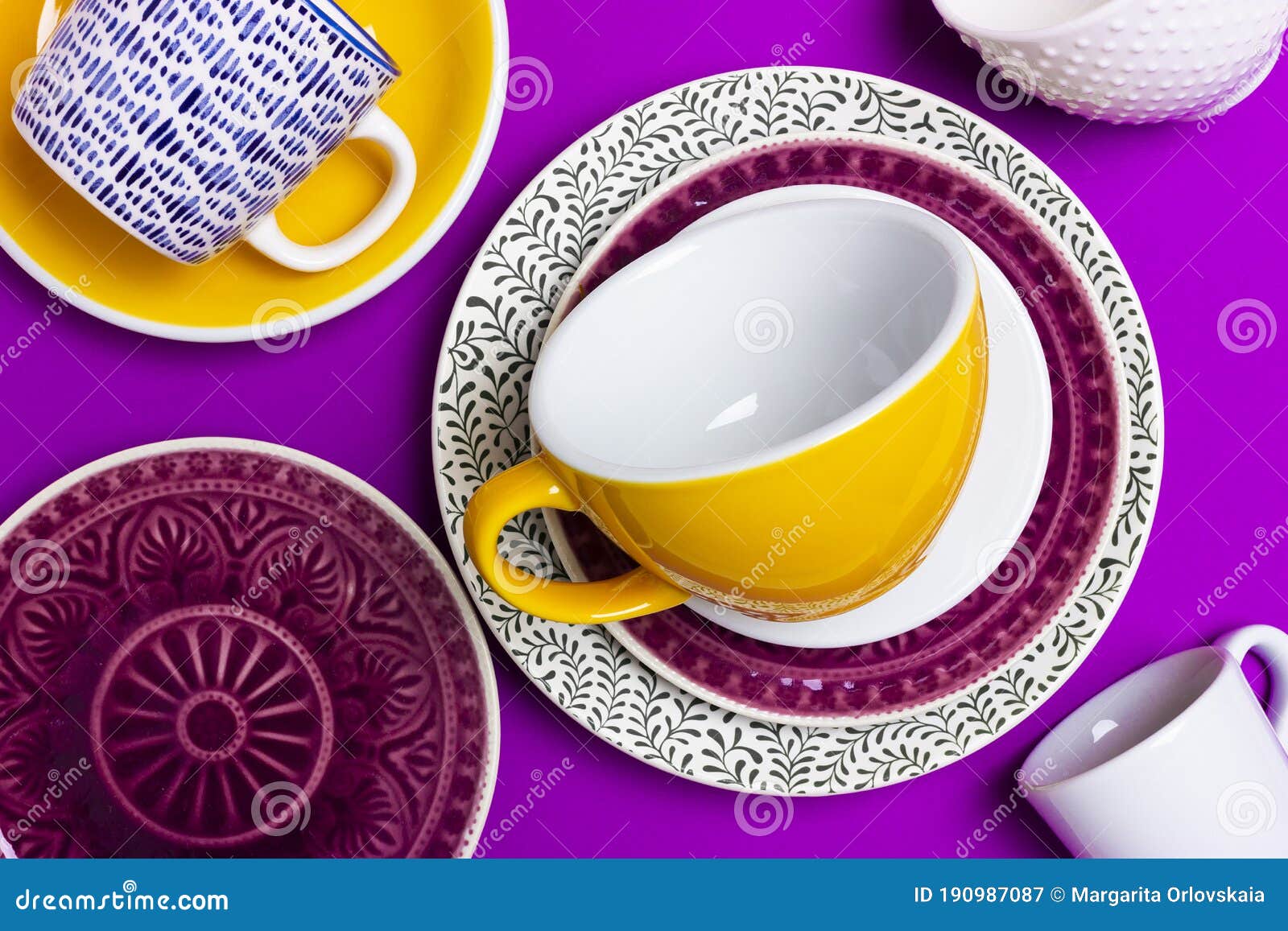 A Collection of Many Different Multi-colored Mugs and Tableware Stock ...