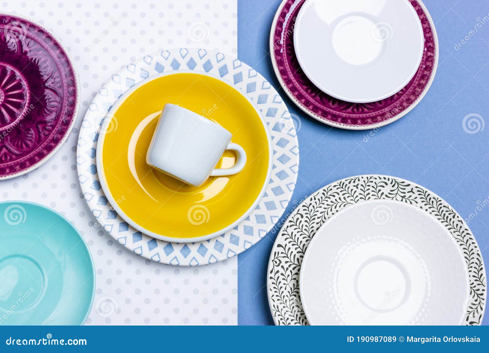 A Collection of Many Different Multi-colored Mugs and Tableware Stock ...