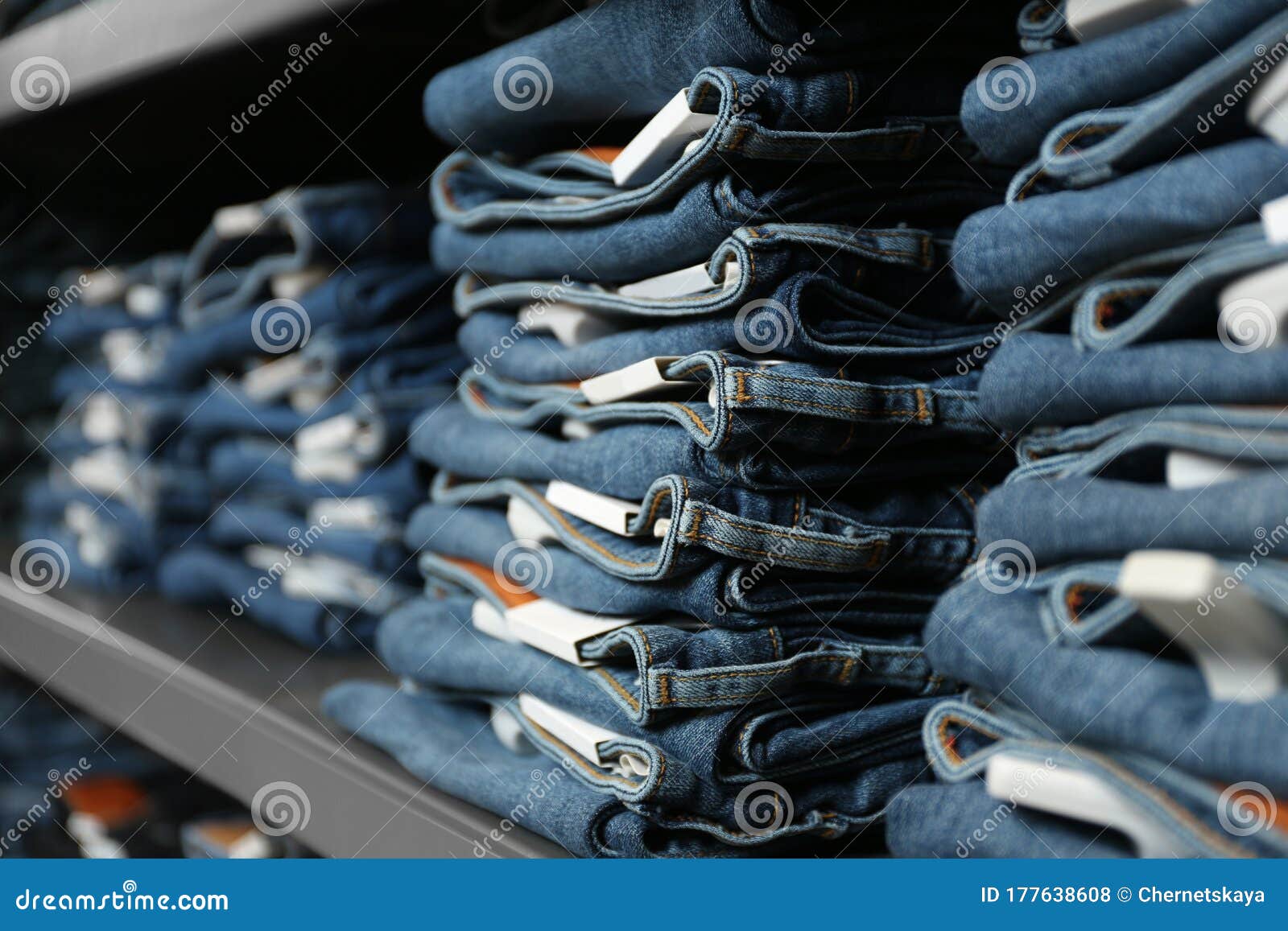 Collection of Modern Jeans on Shelf in Shop Stock Photo - Image of ...