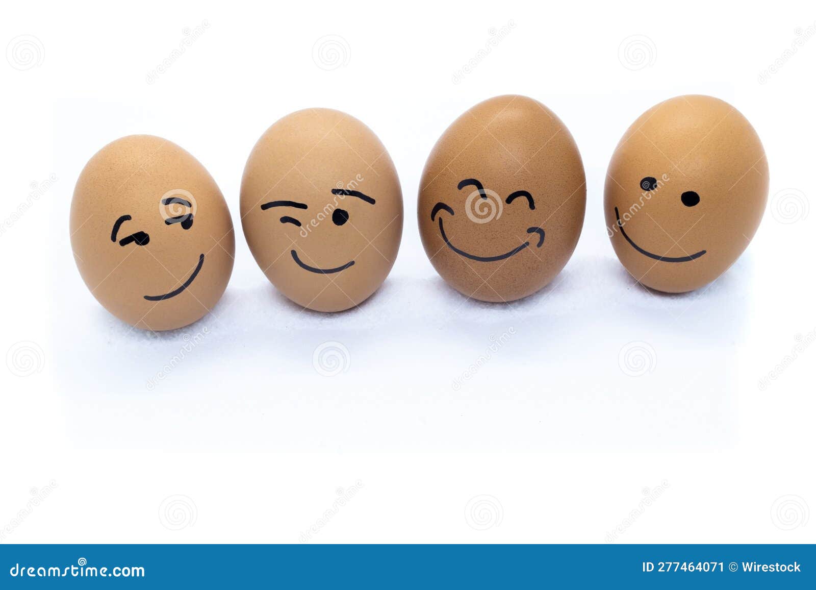Collection of Multicolored Eggs with Human Facial Features Drawn upon ...